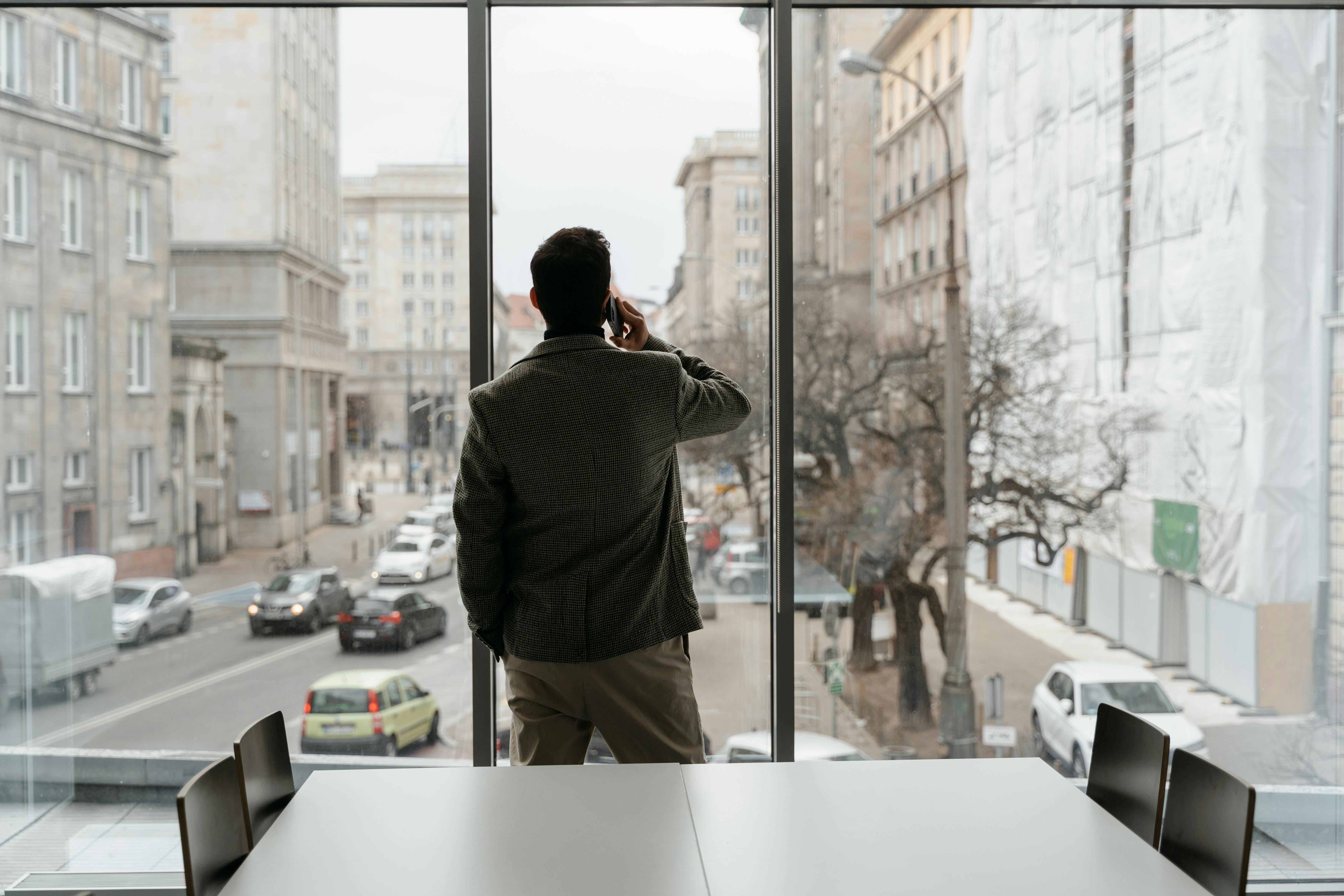 A Man Having a Phone Call in the Office · Free Stock Photo