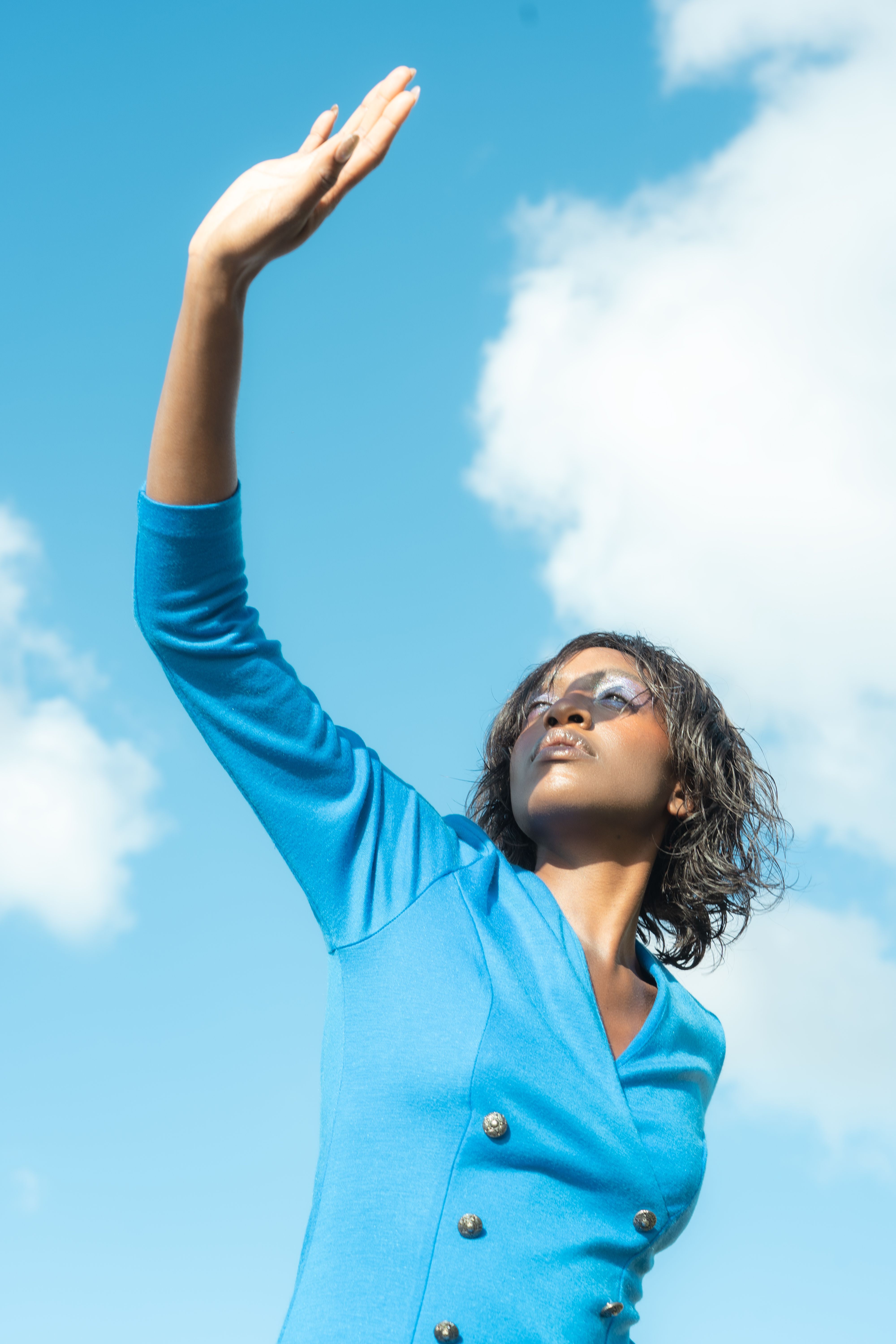 A Woman Shading Herself From the Sun · Free Stock Photo