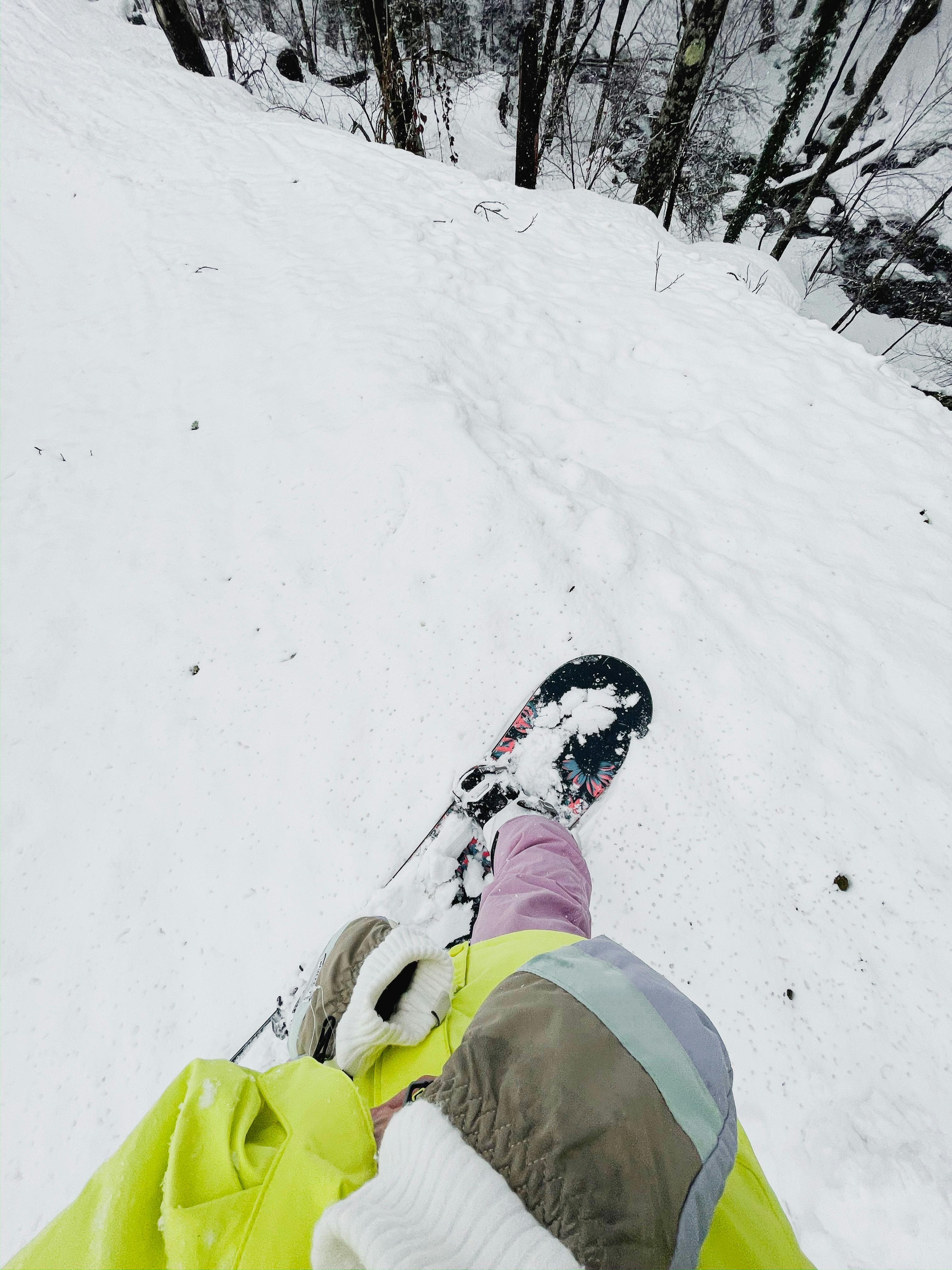 Woman Snowboarding on a Slope · Free Stock Photo