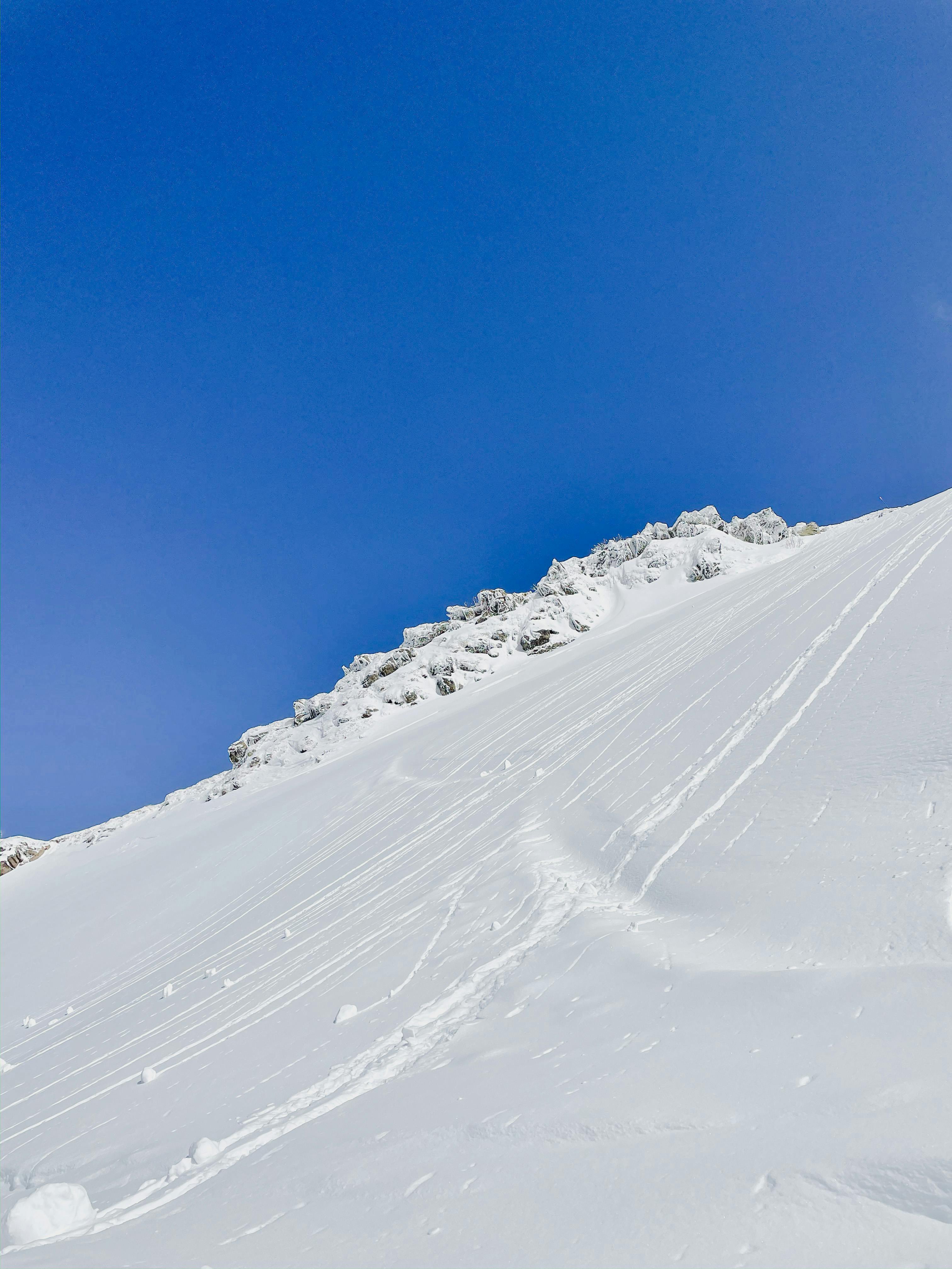 Slope in Snow Under Clear Blue Sky · Free Stock Photo