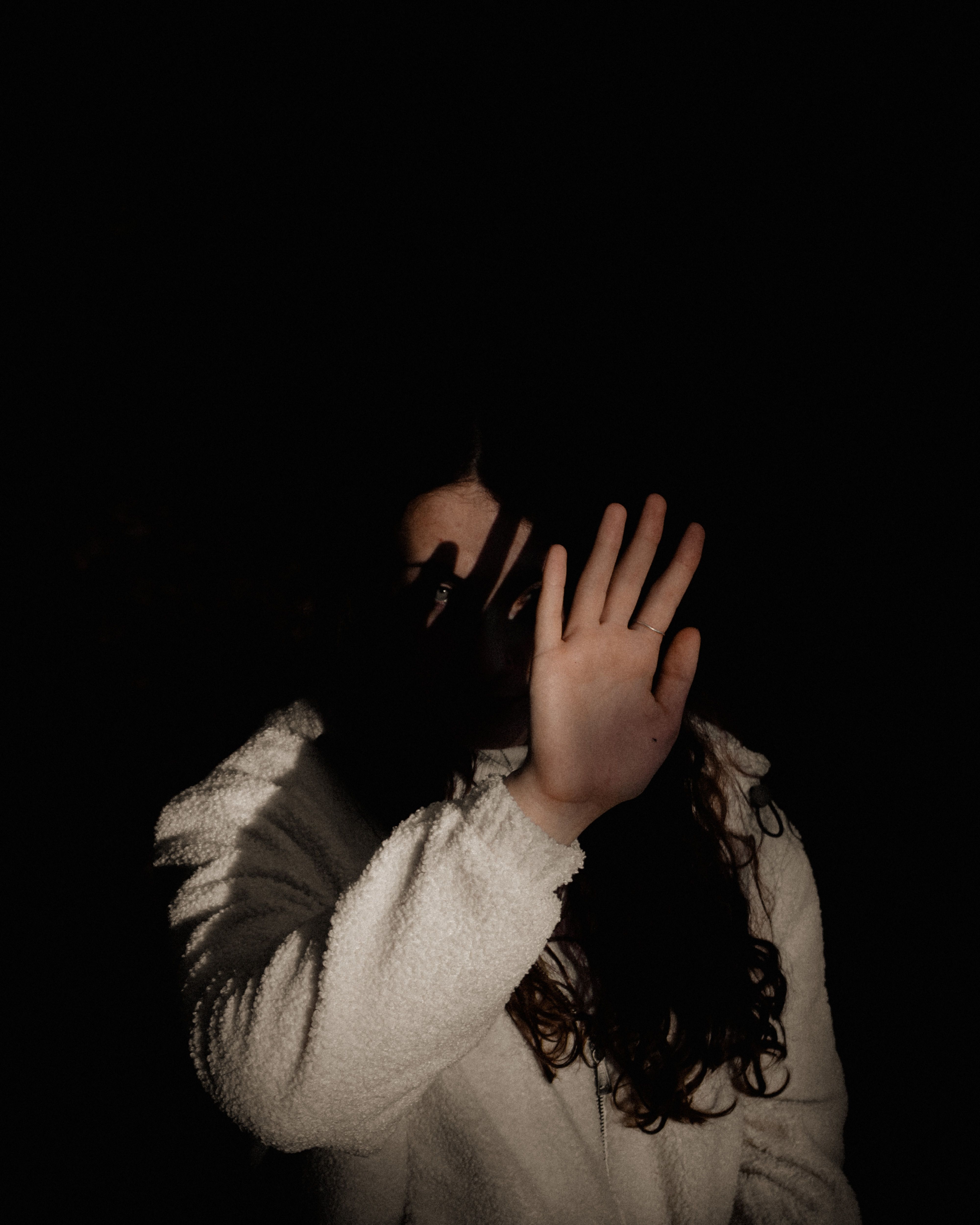 Girl Covering Her Face