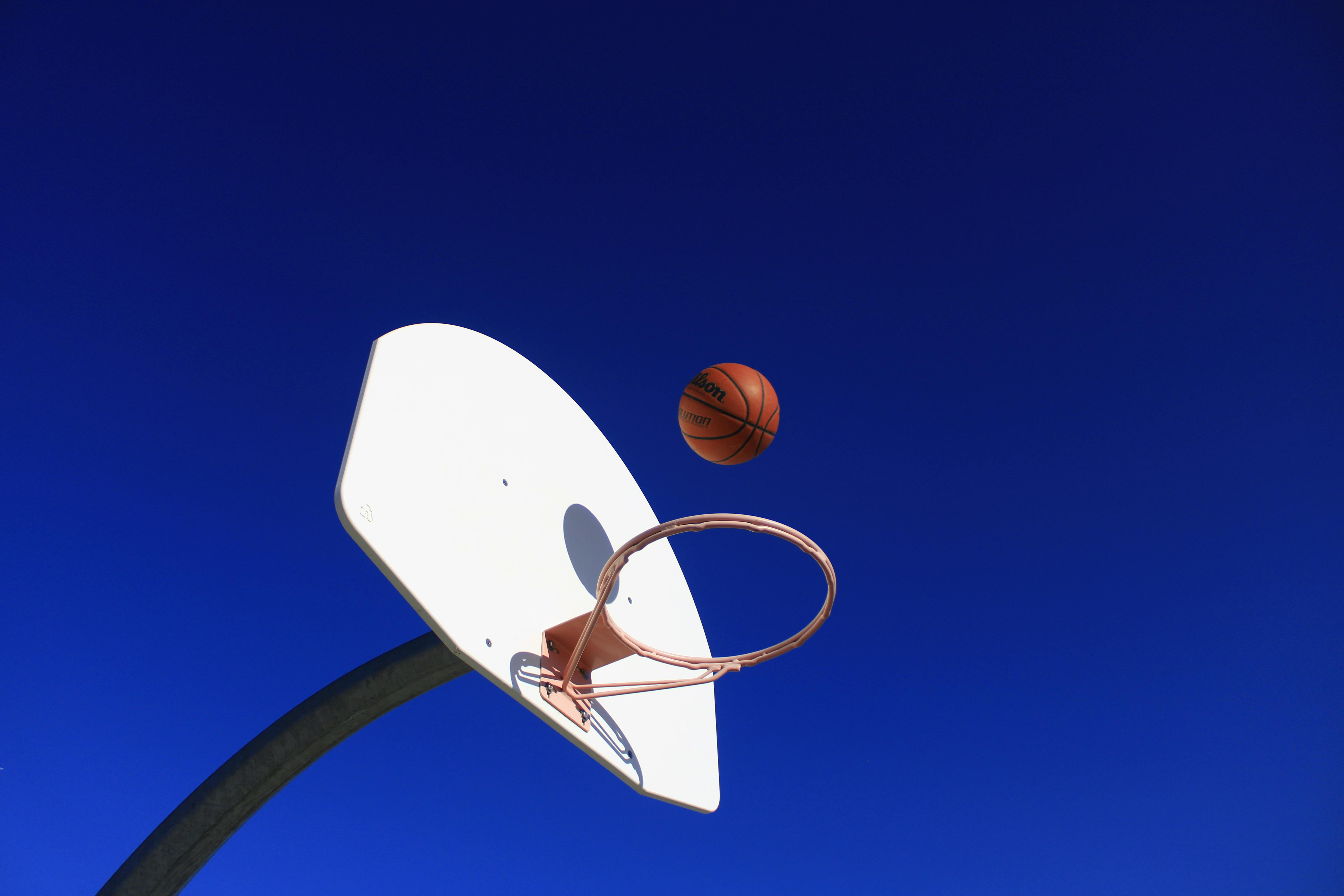 Basketball Ball Flying into Hoop · Free Stock Photo