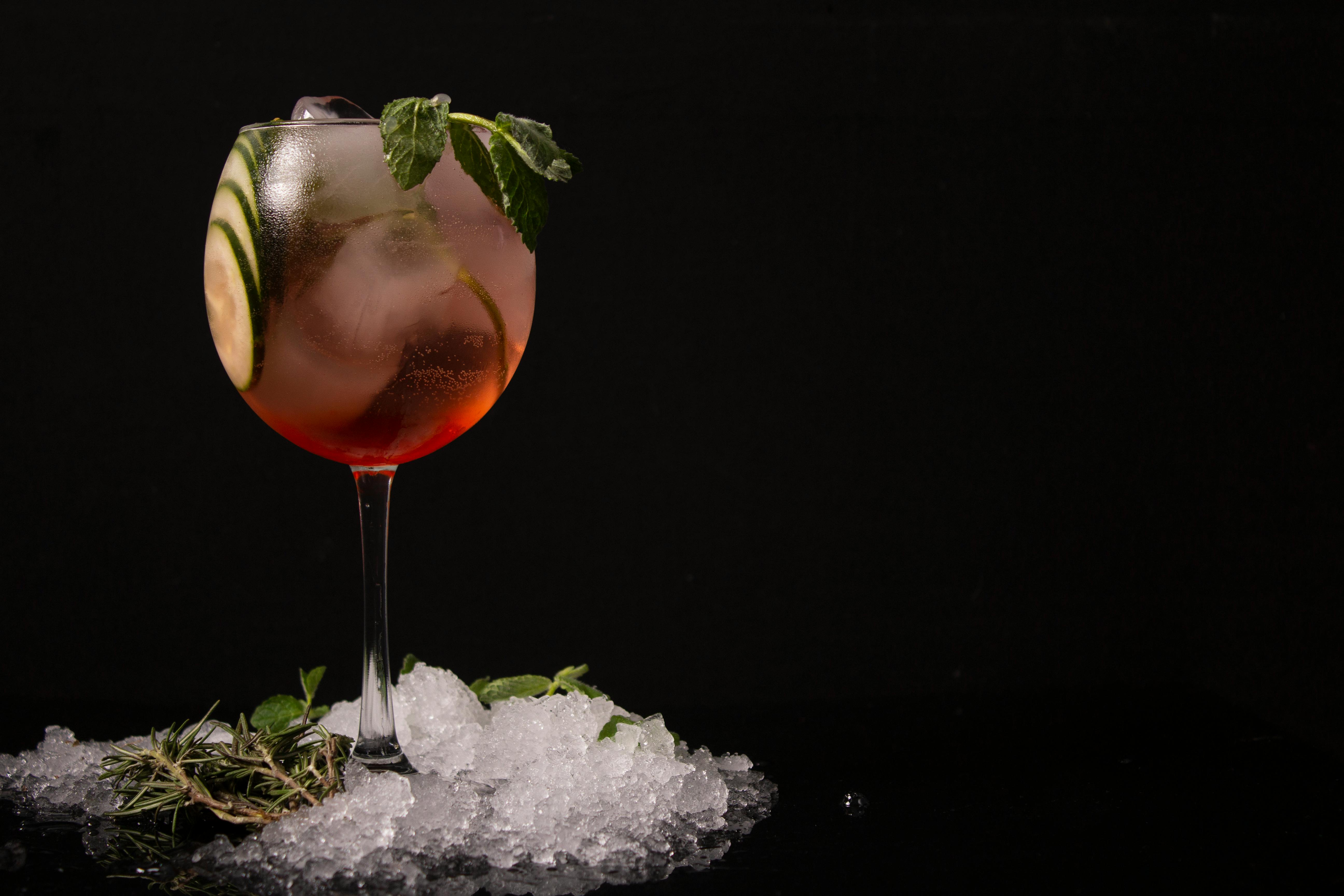 An Ice Cold Cocktail on Wooden Table and Black Background · Free Stock ...