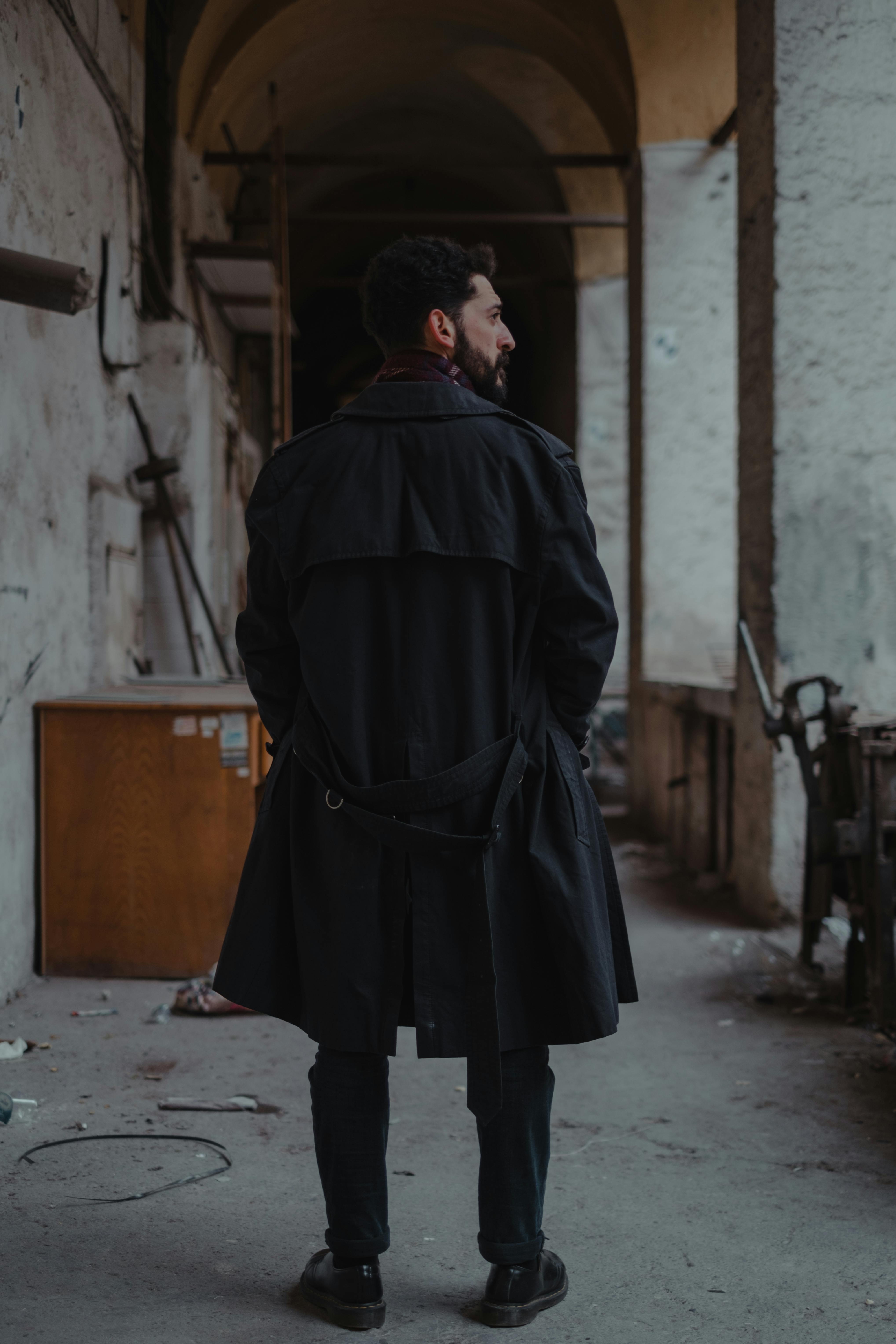 Anonymous man standing in abandoned house · Free Stock Photo
