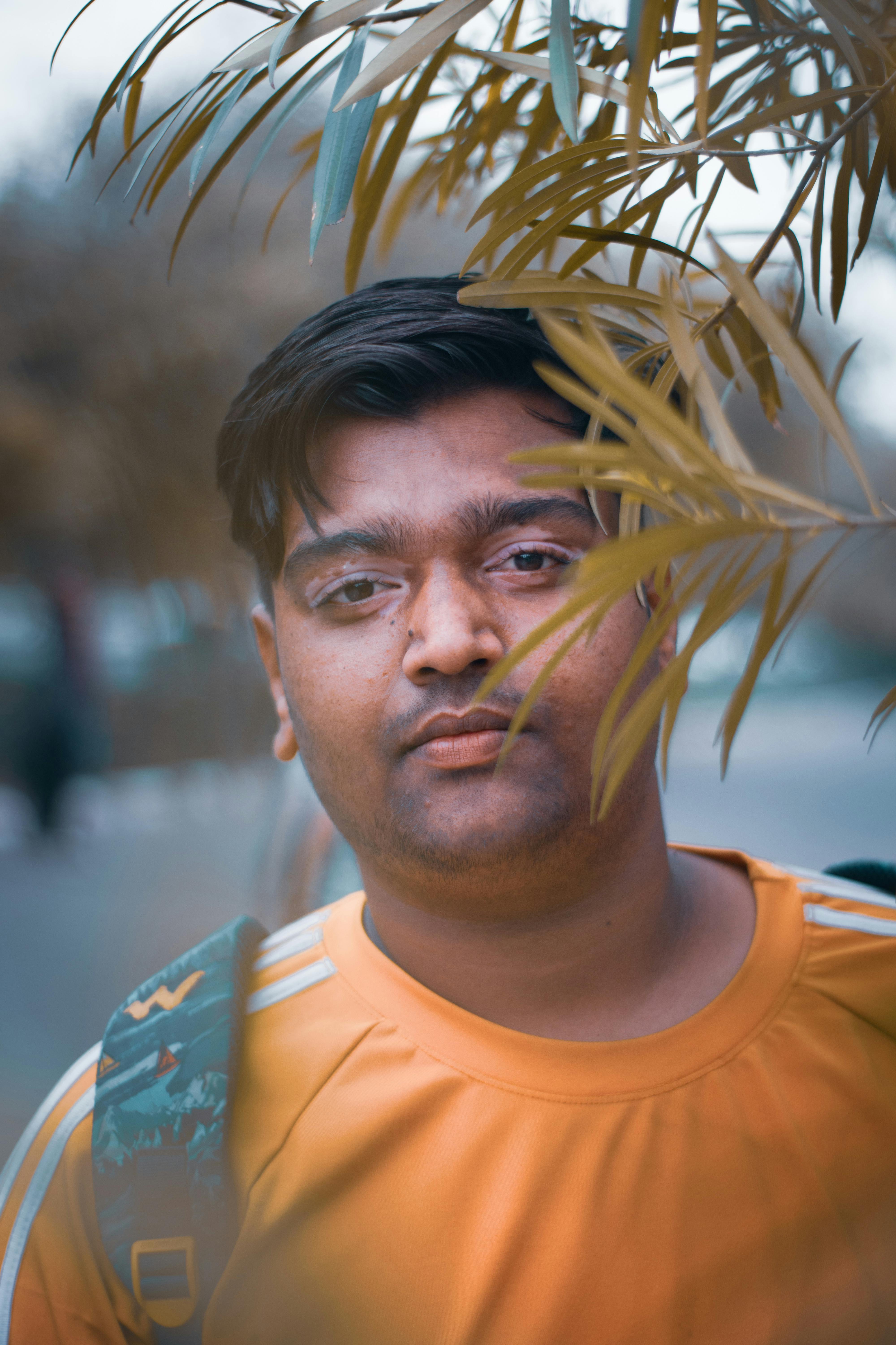 A Man Wearing an Orange Shirt · Free Stock Photo
