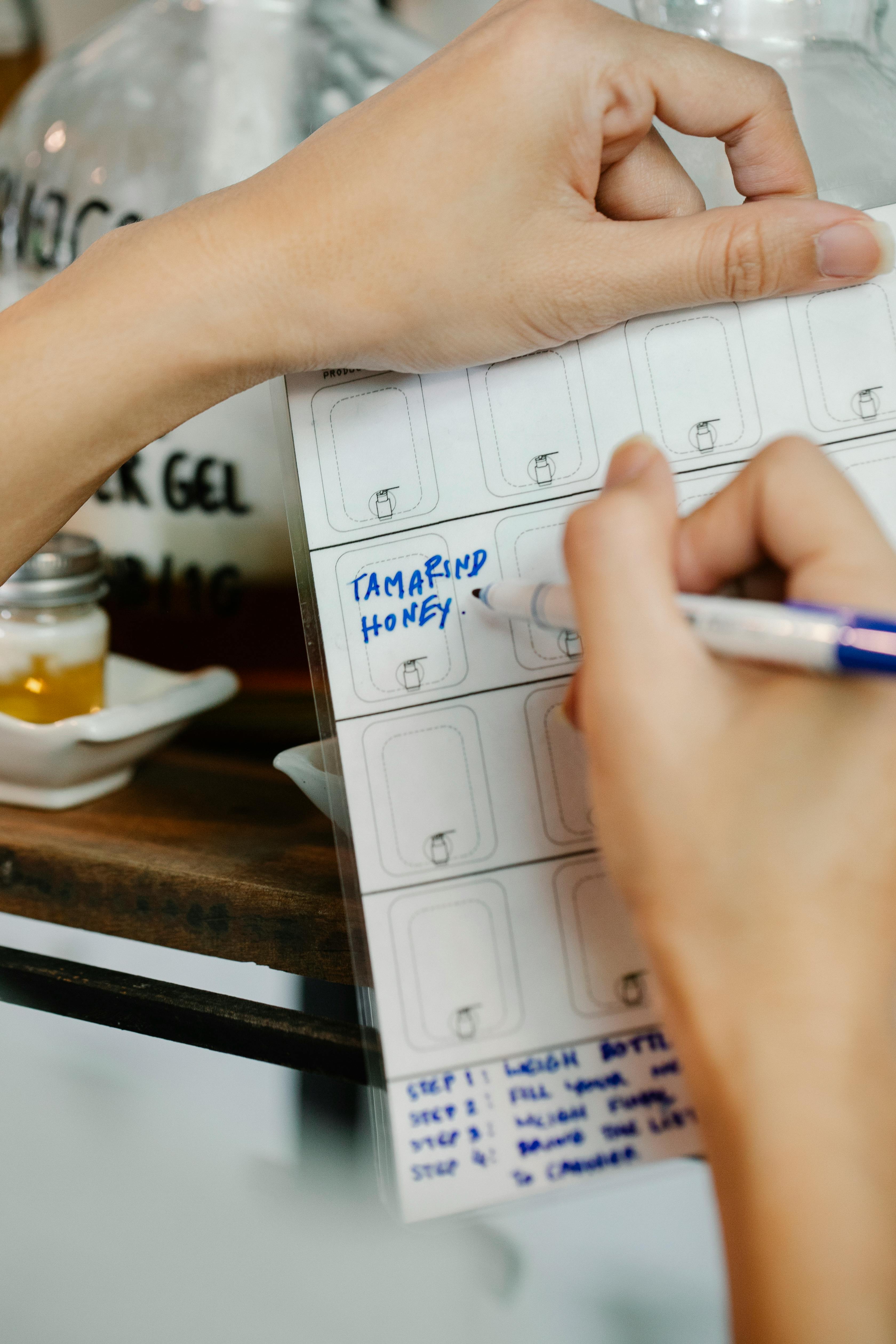 Person Writing on White Paper · Free Stock Photo