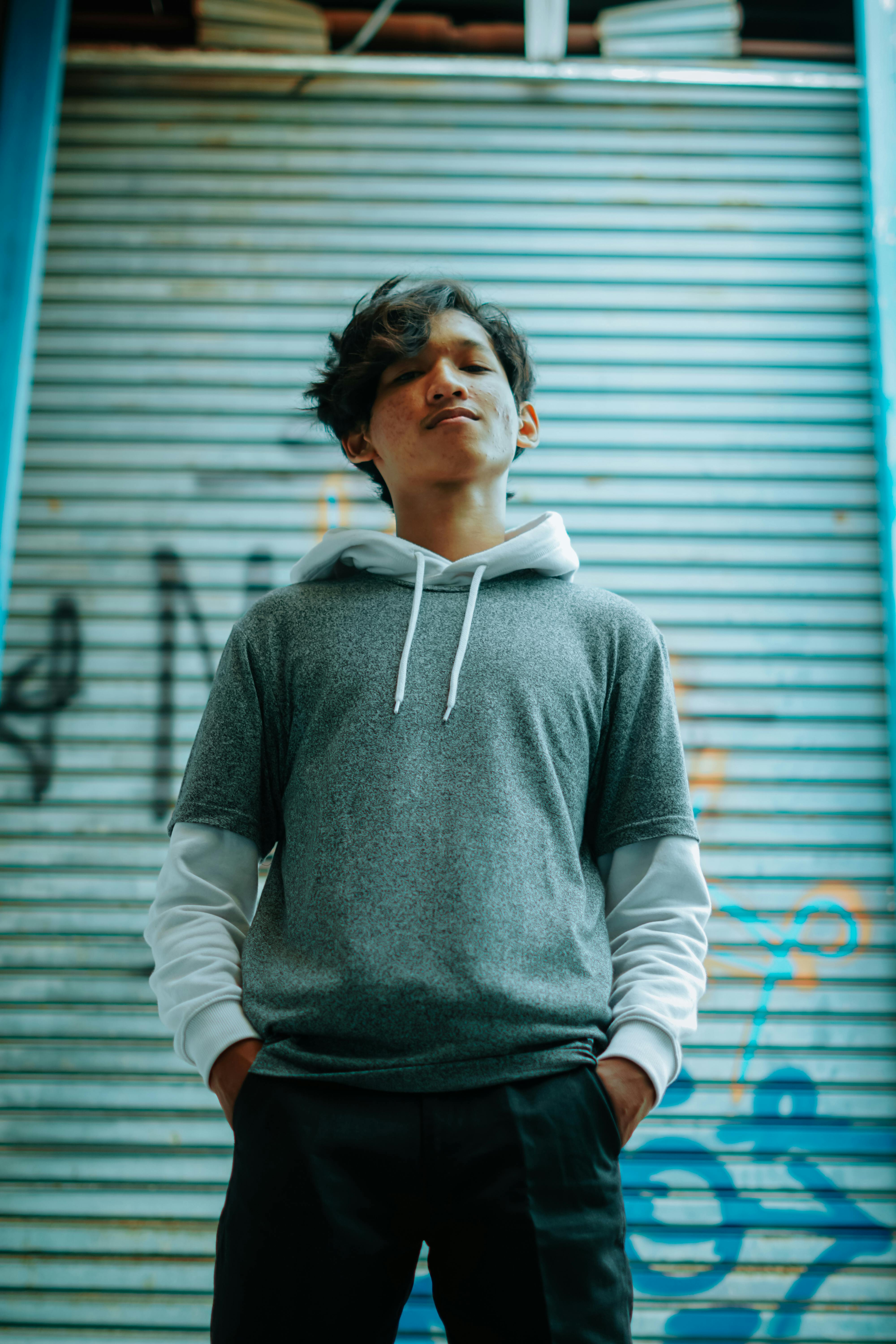 Trendy ethnic male chilling on balcony · Free Stock Photo