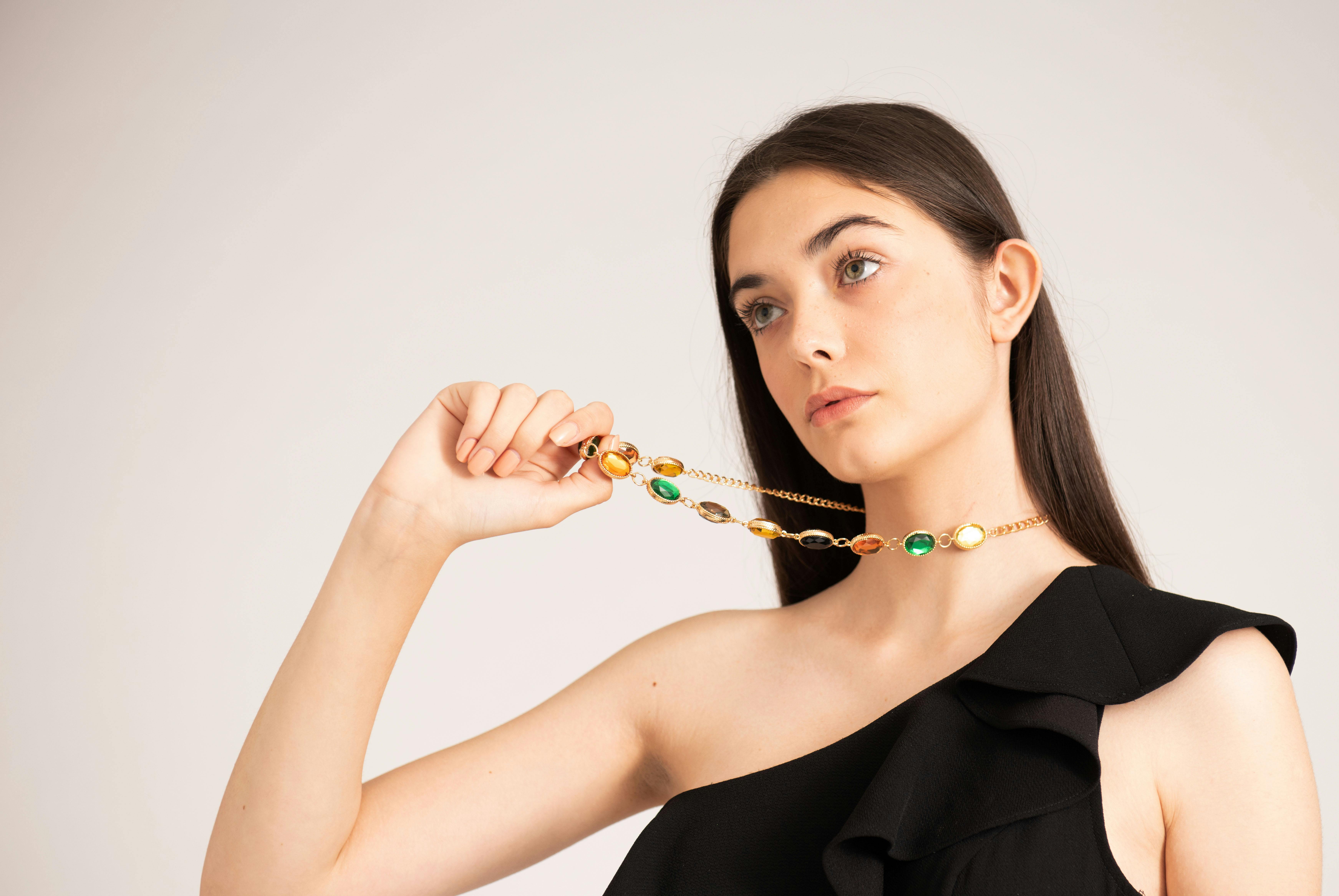Woman Holding Fan · Free Stock Photo