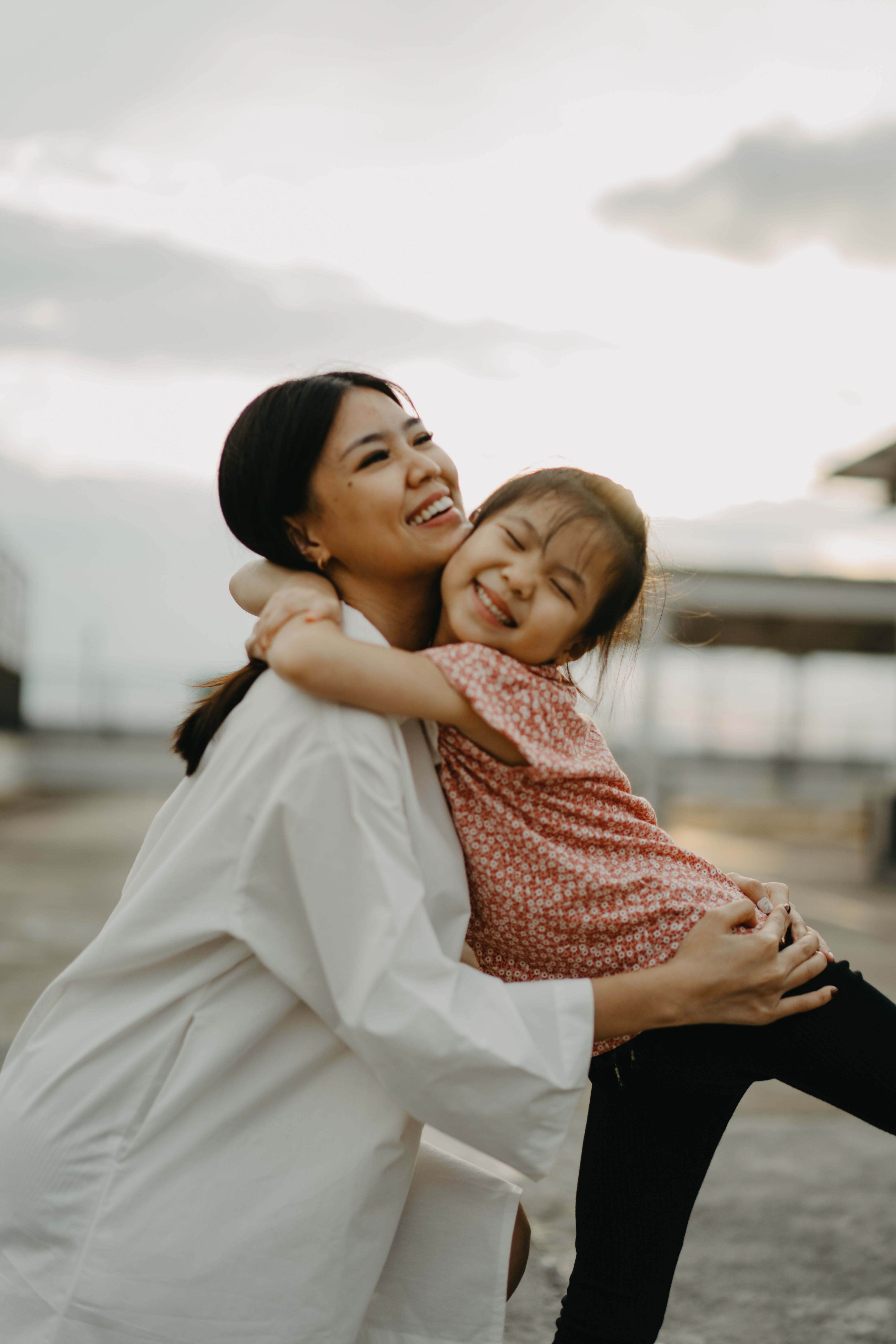 A Girl Hugging her Daughter · Free Stock Photo
