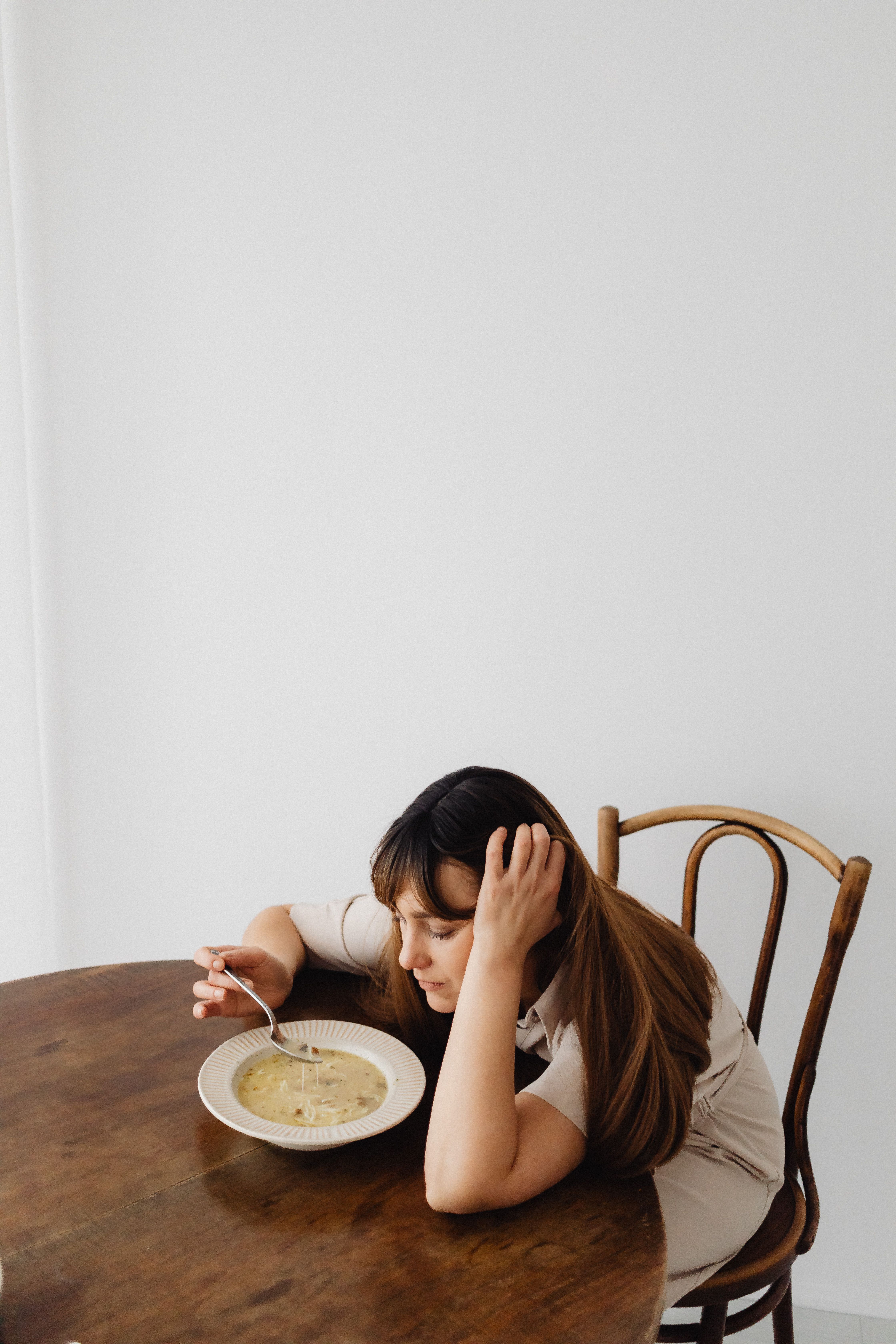 Bored Woman Eating Soup · Free Stock Photo