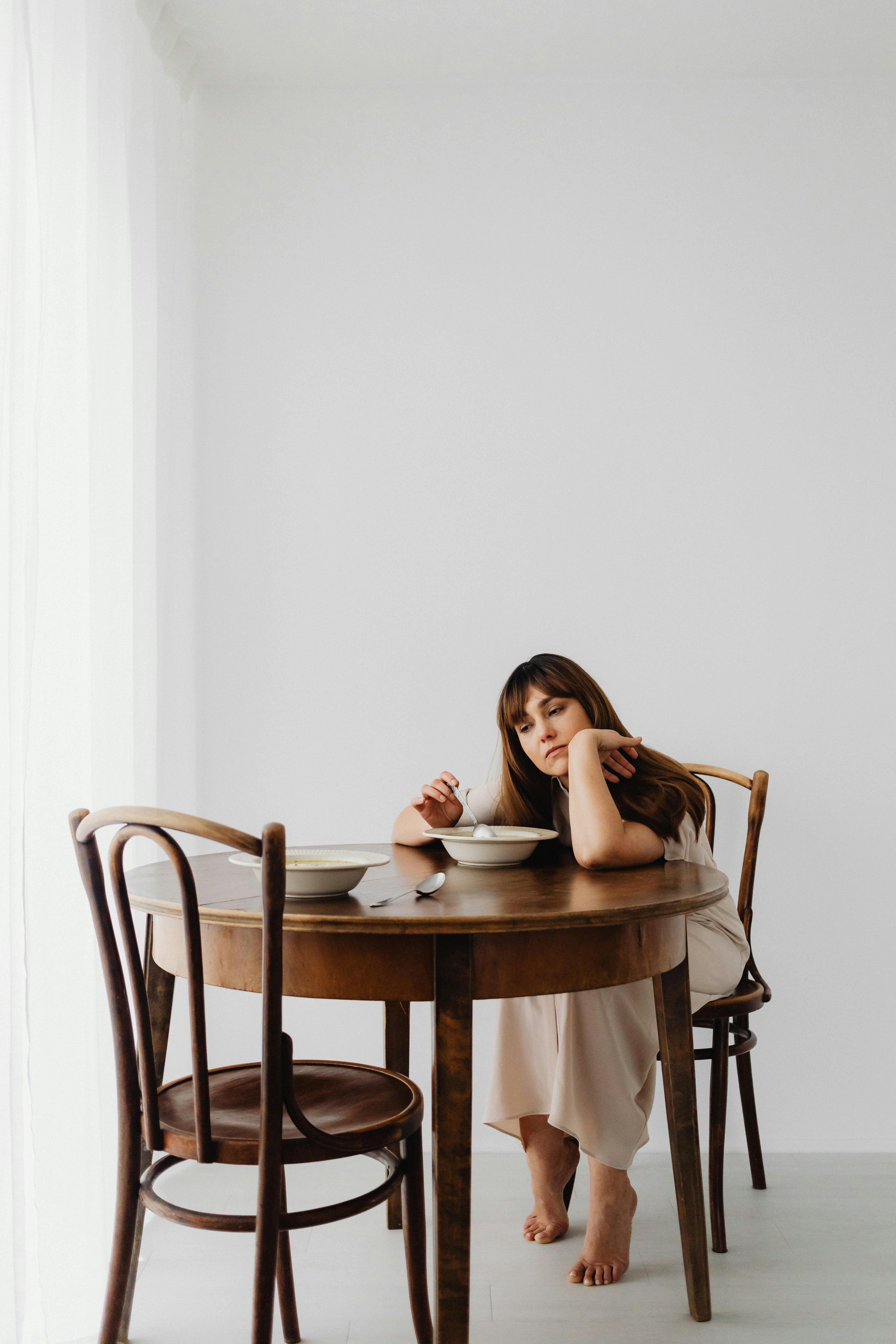 Sad Woman Sitting Alone at the Table · Free Stock Photo