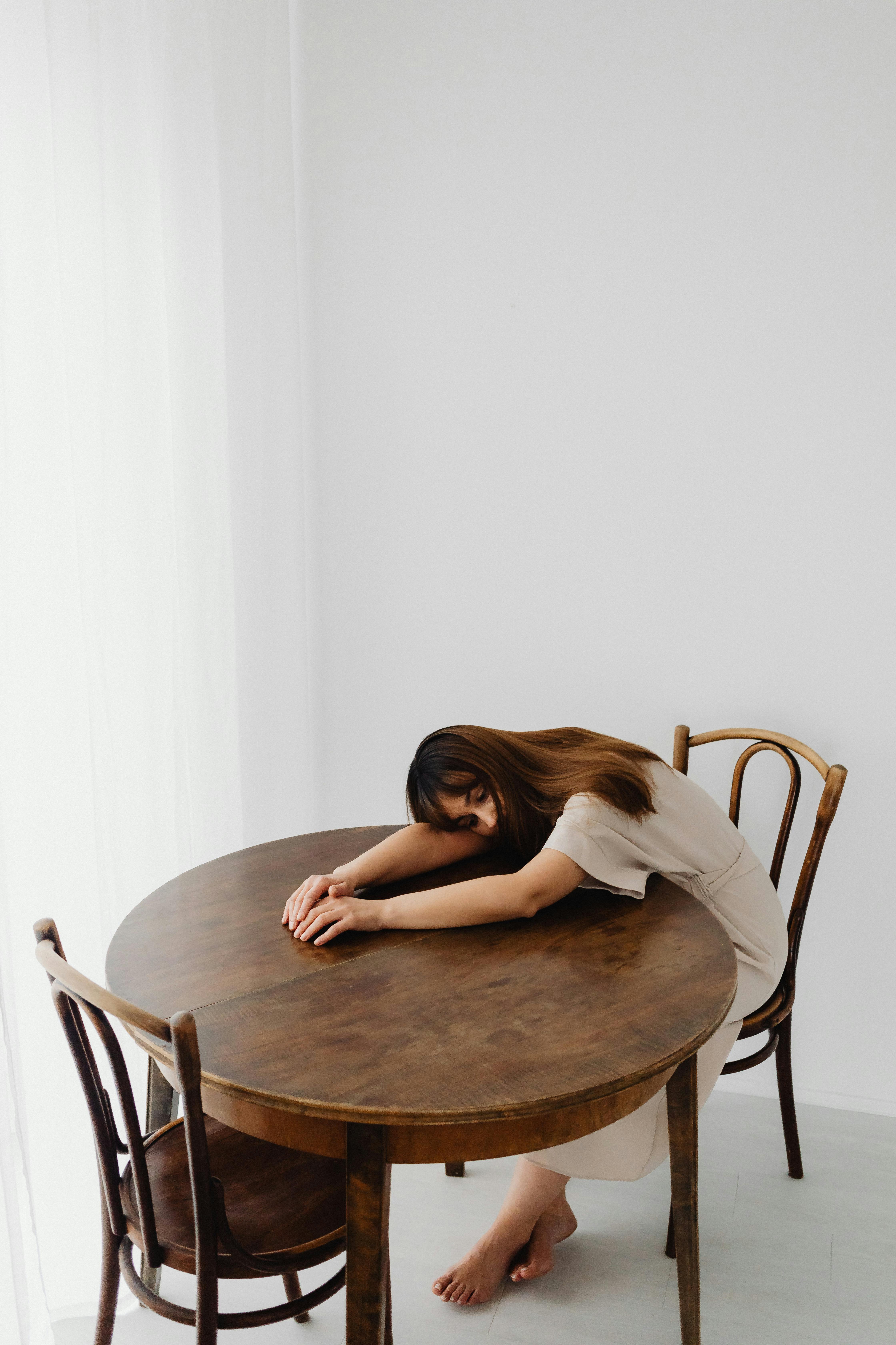 Woman Leaning on the Table · Free Stock Photo