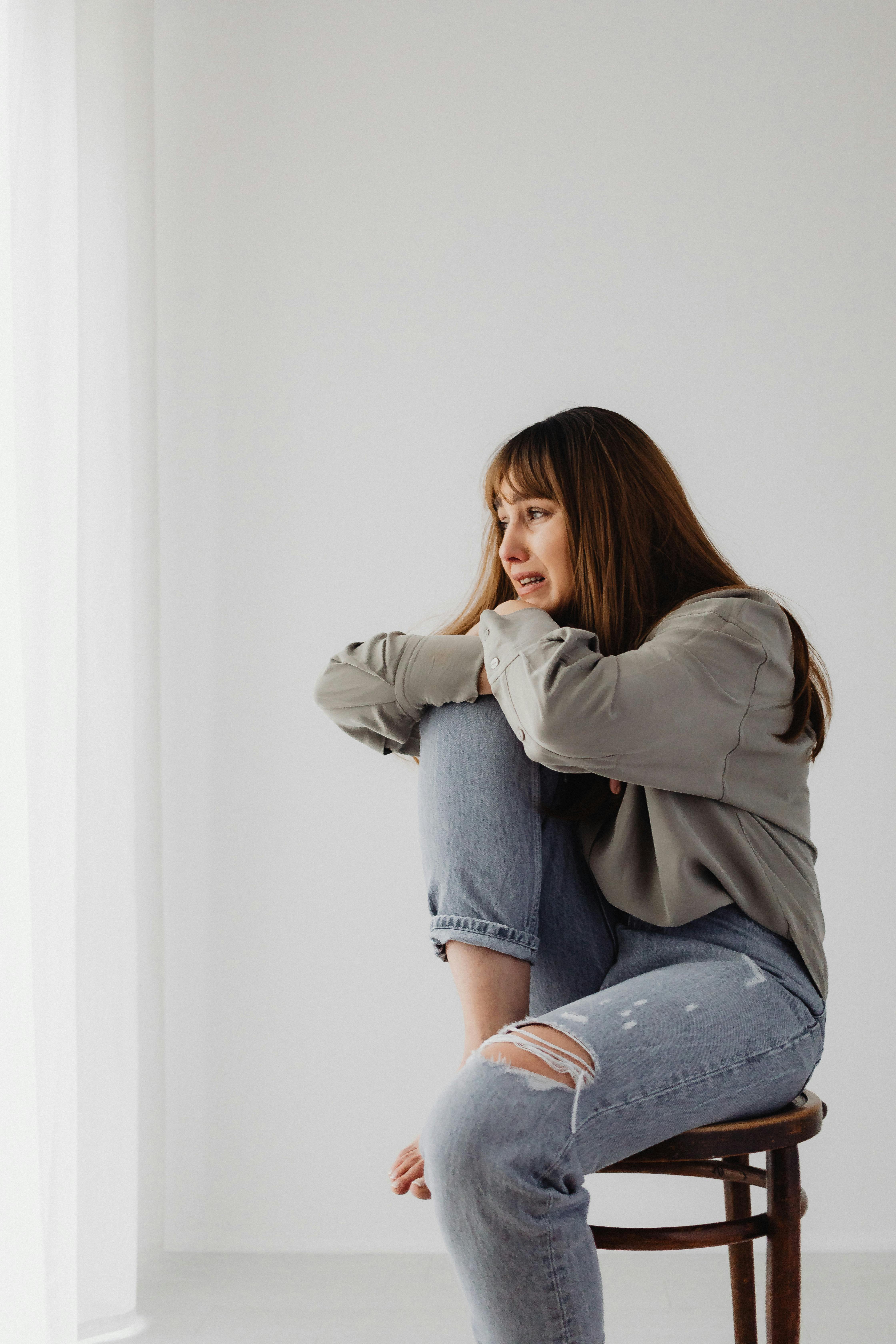 Sad Woman on Chair · Free Stock Photo