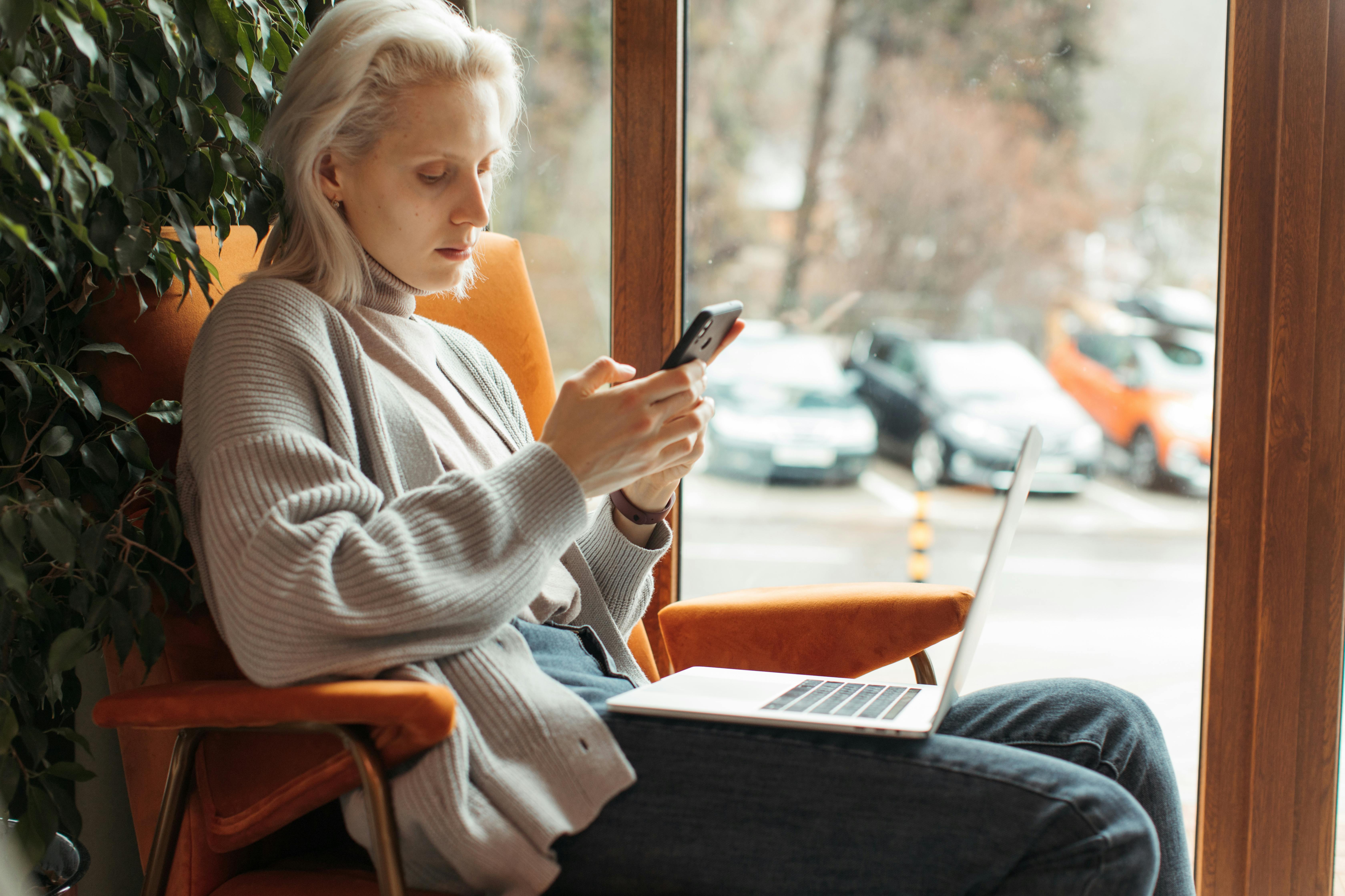 A Woman Using a Smartphone · Free Stock Photo
