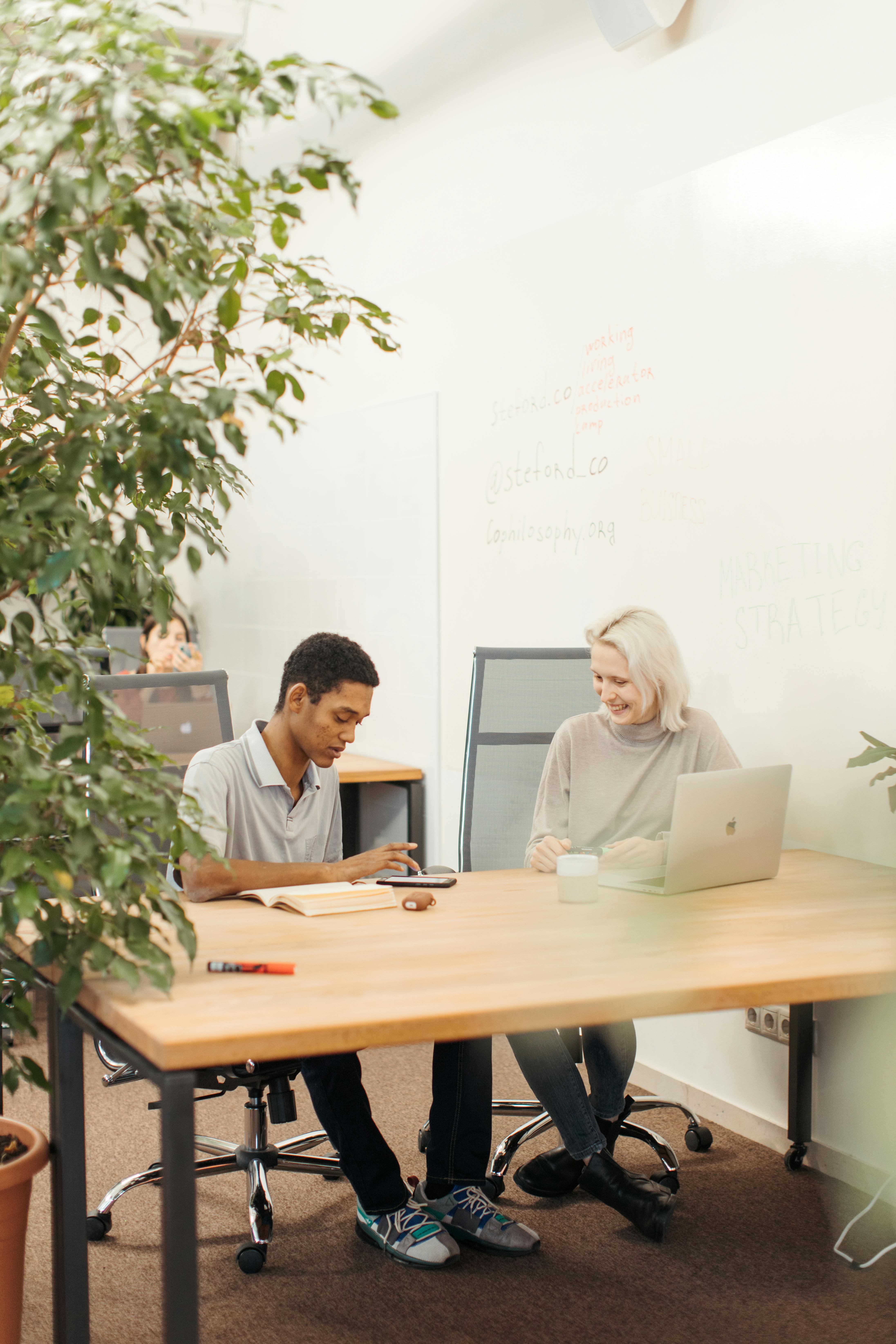 Man and Woman Sitting at the Table · Free Stock Photo