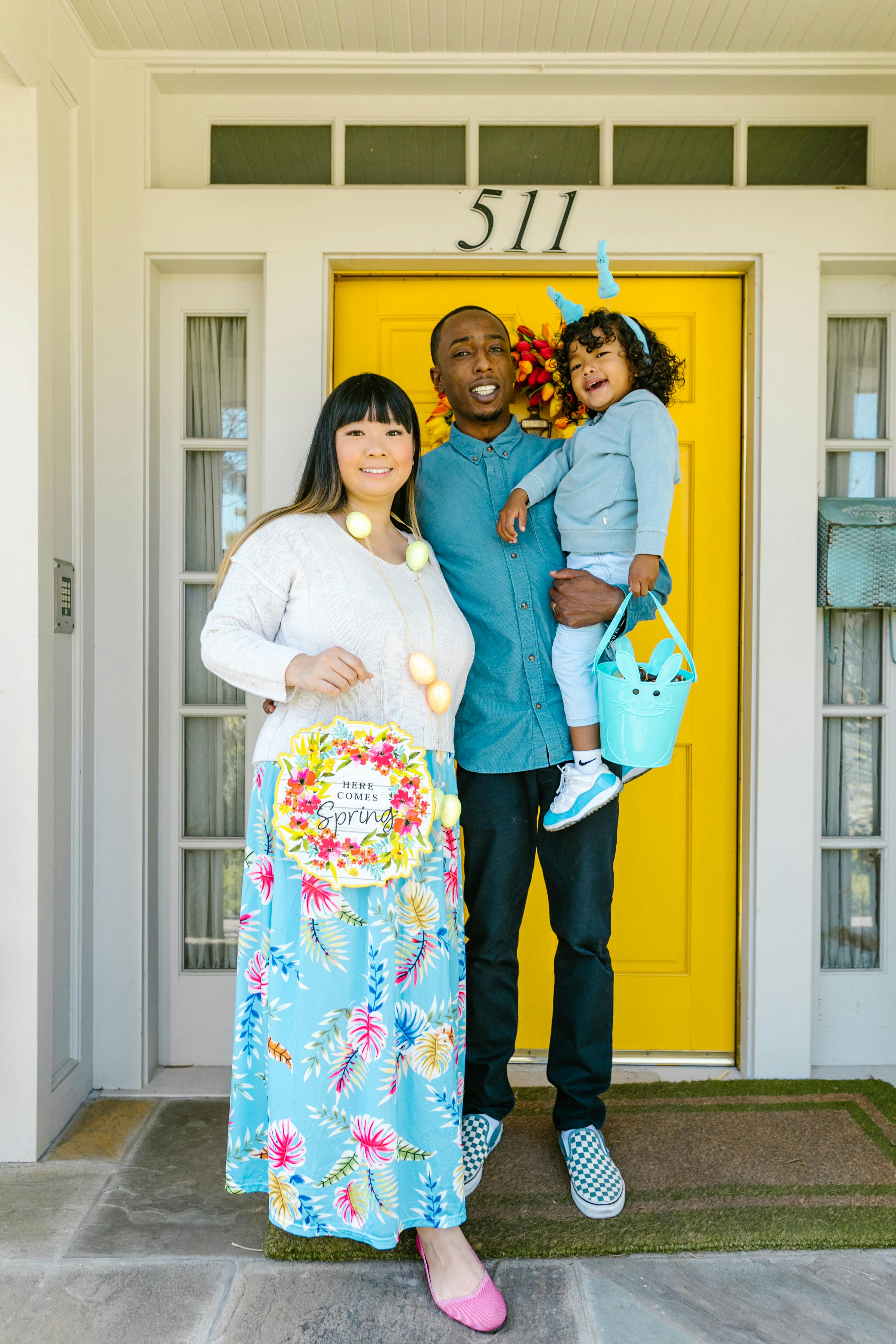 A Family Standing at the Front Door · Free Stock Photo
