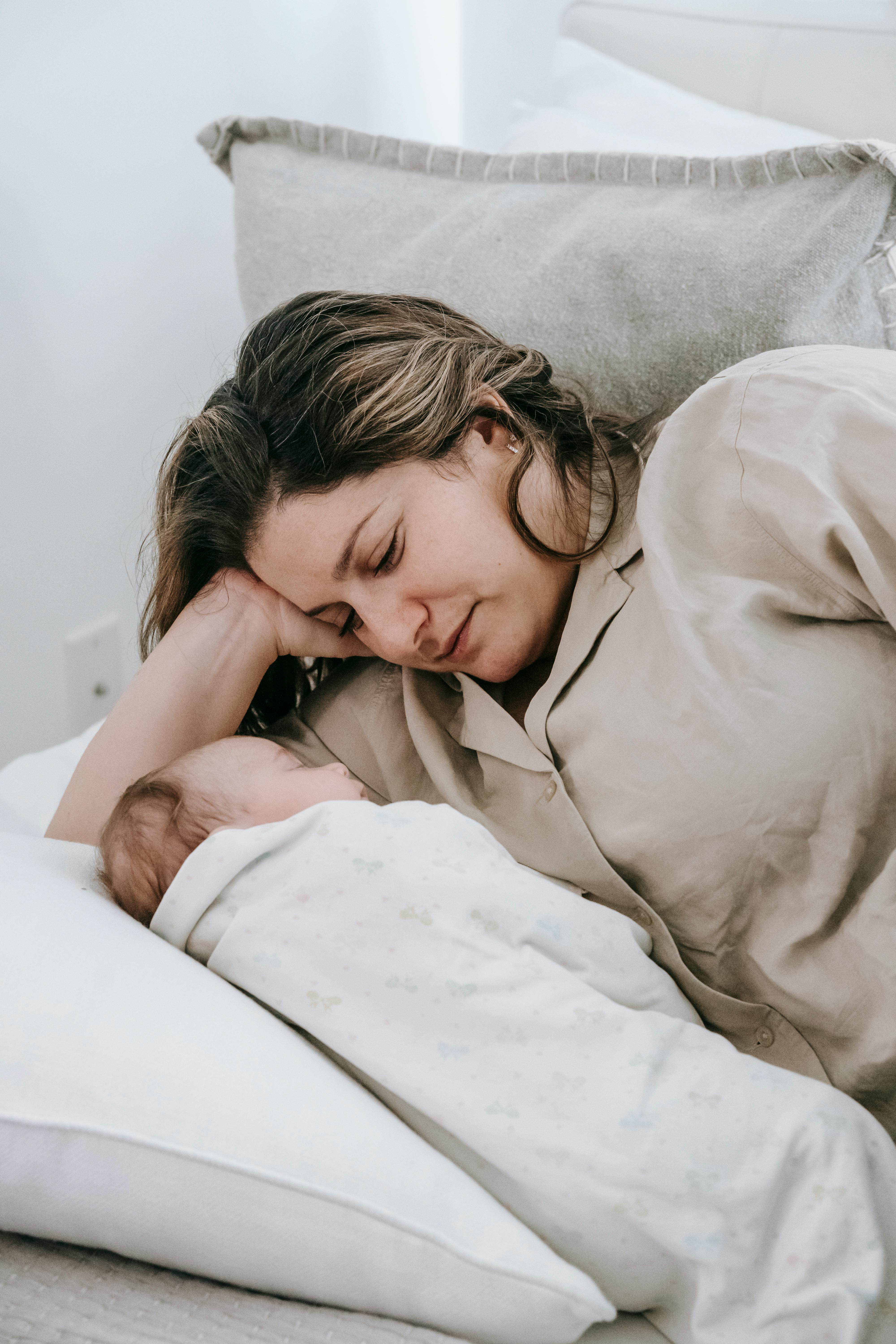 Mother Looking at Her Baby · Free Stock Photo