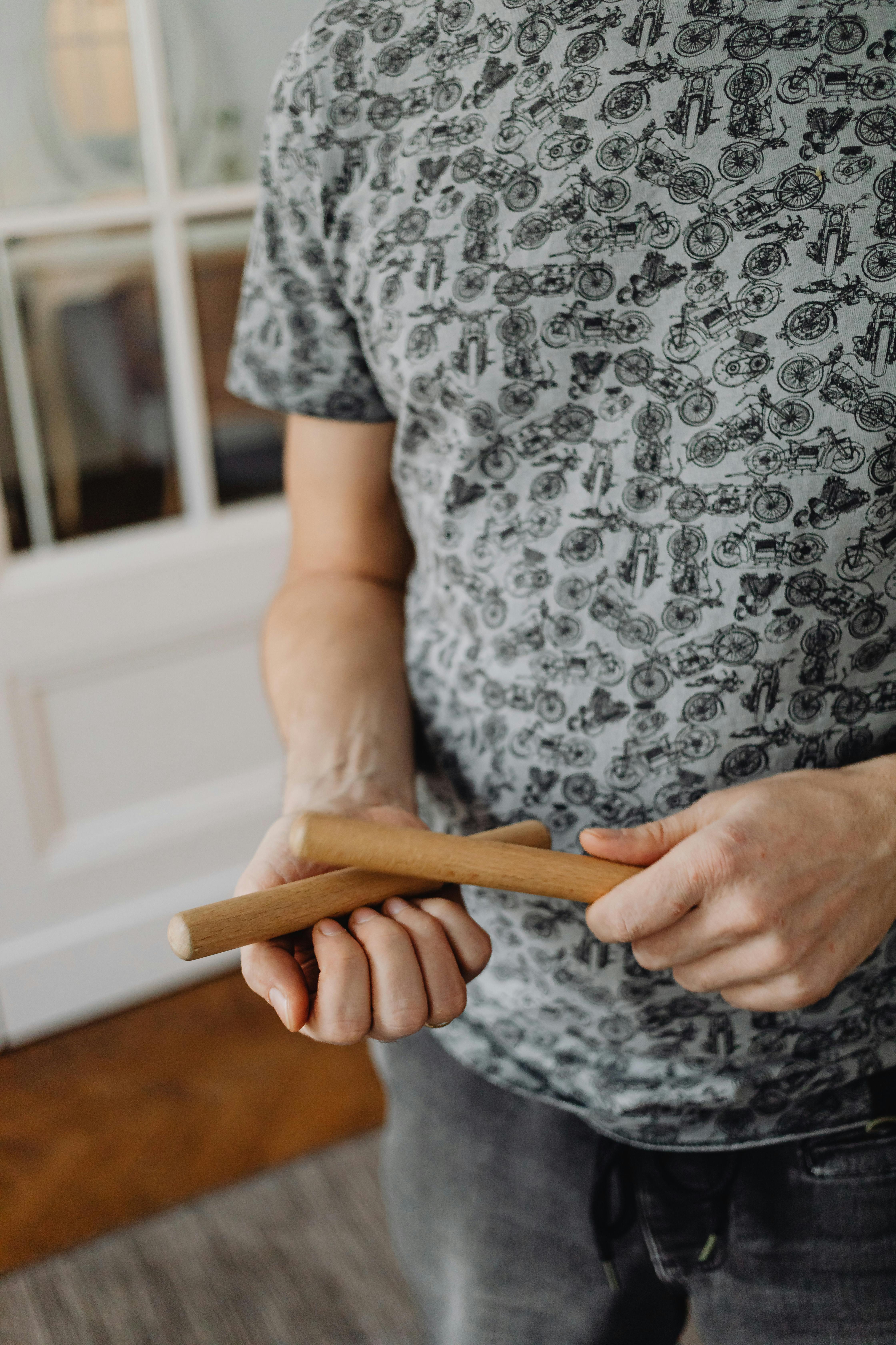 Close-Up Shot of a Person Playing Wooden Claves · Free Stock Photo