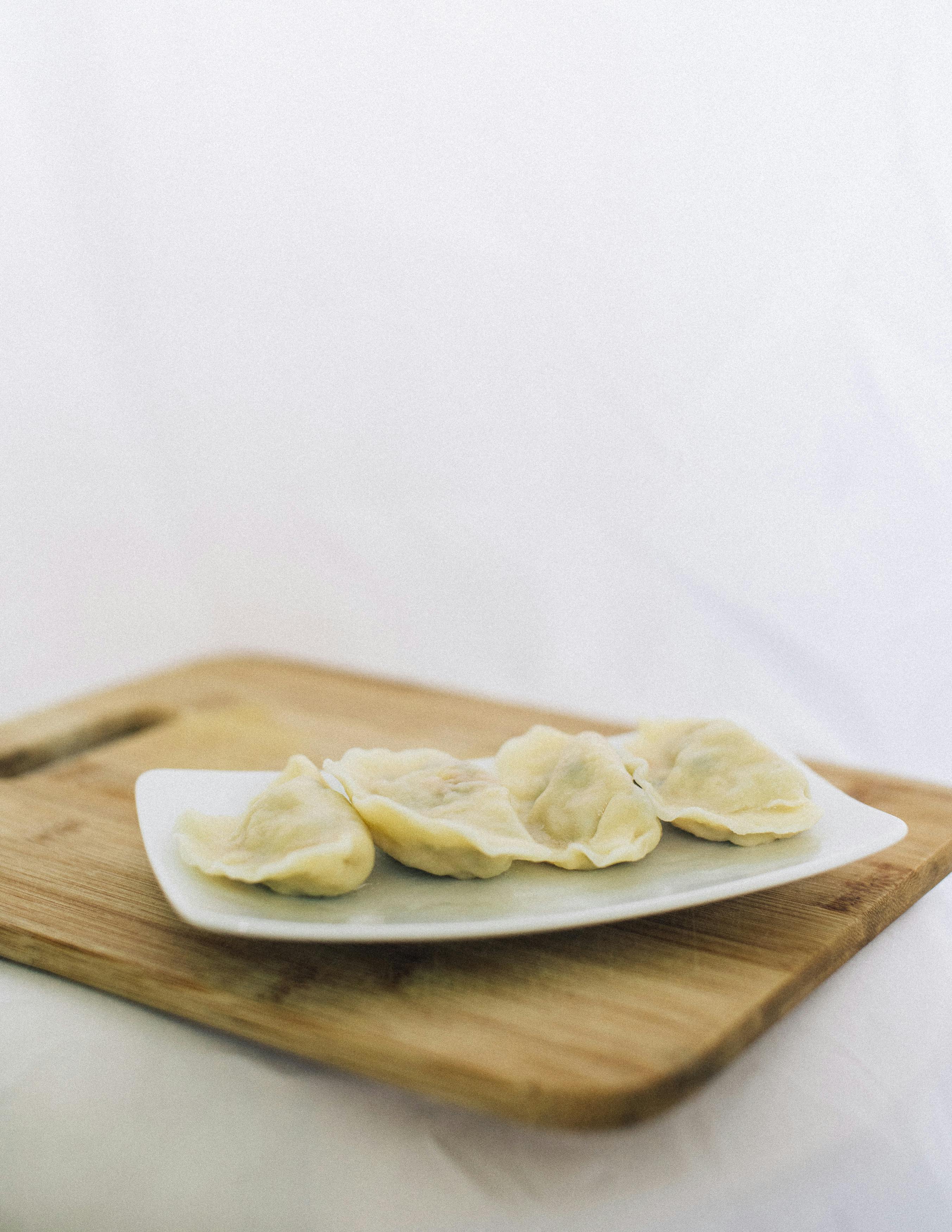 Steamed Dumplings on a Ceramic Plate · Free Stock Photo