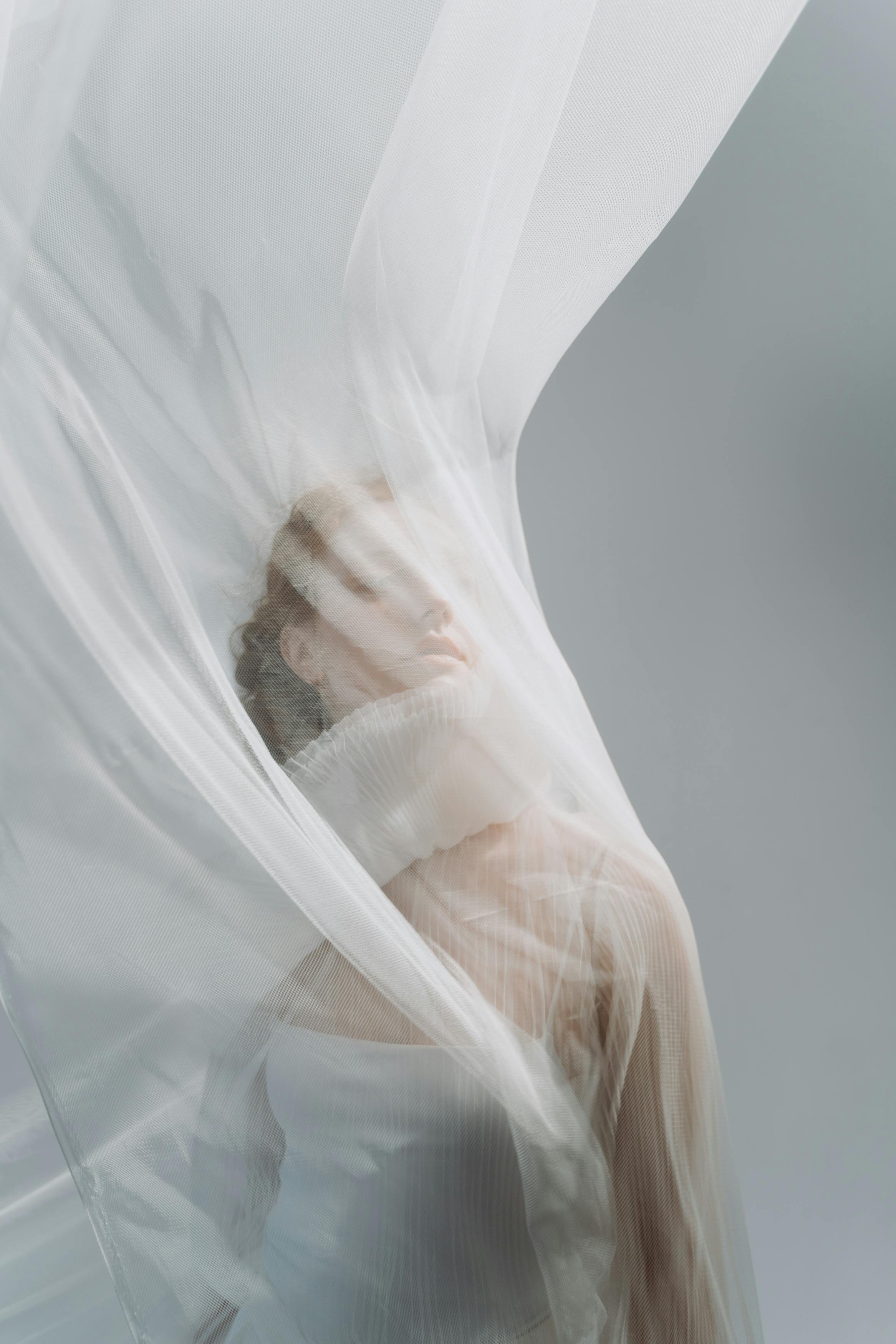 Woman under a Sheer Fabric · Free Stock Photo