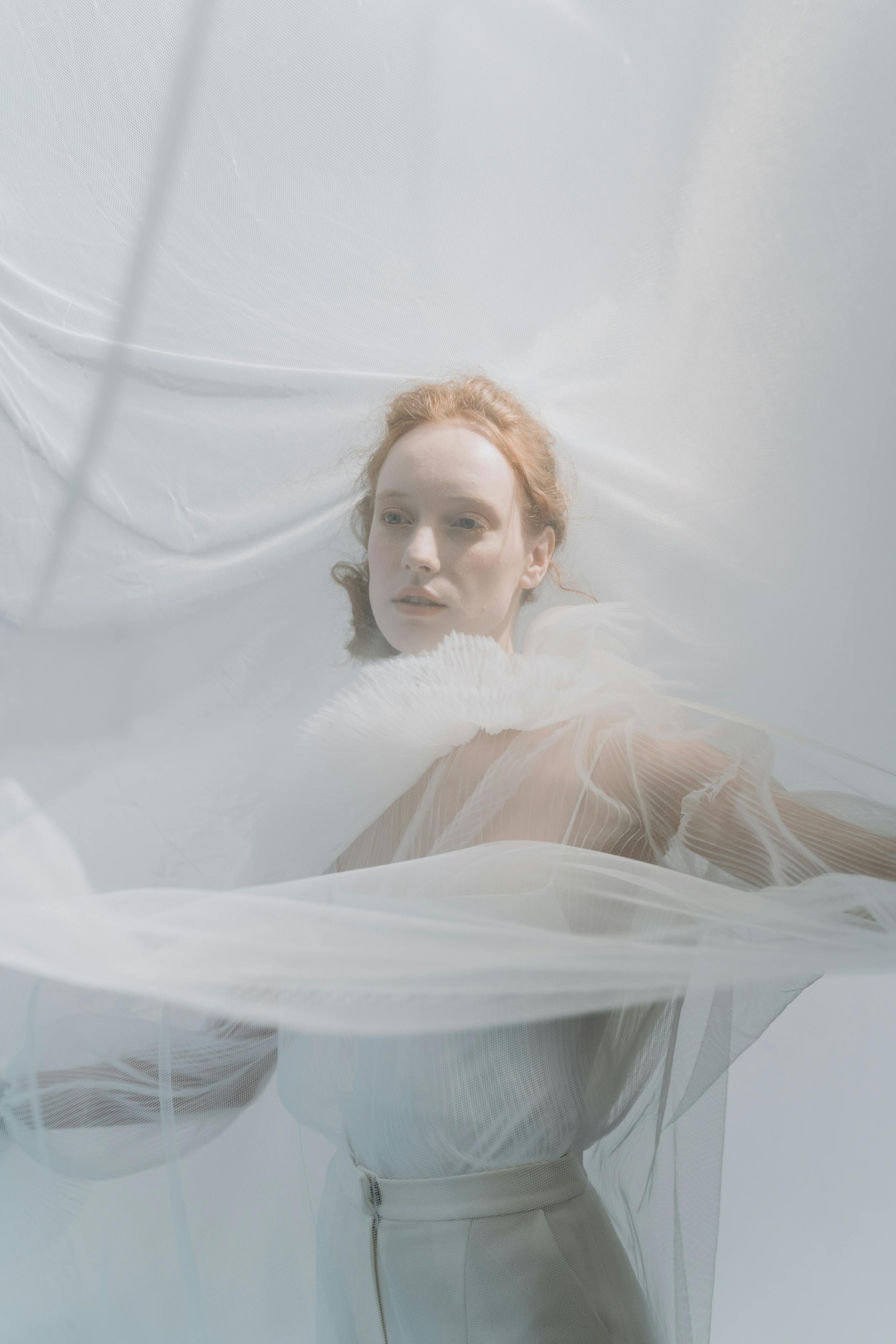 Woman Portrait behind Fabric · Free Stock Photo