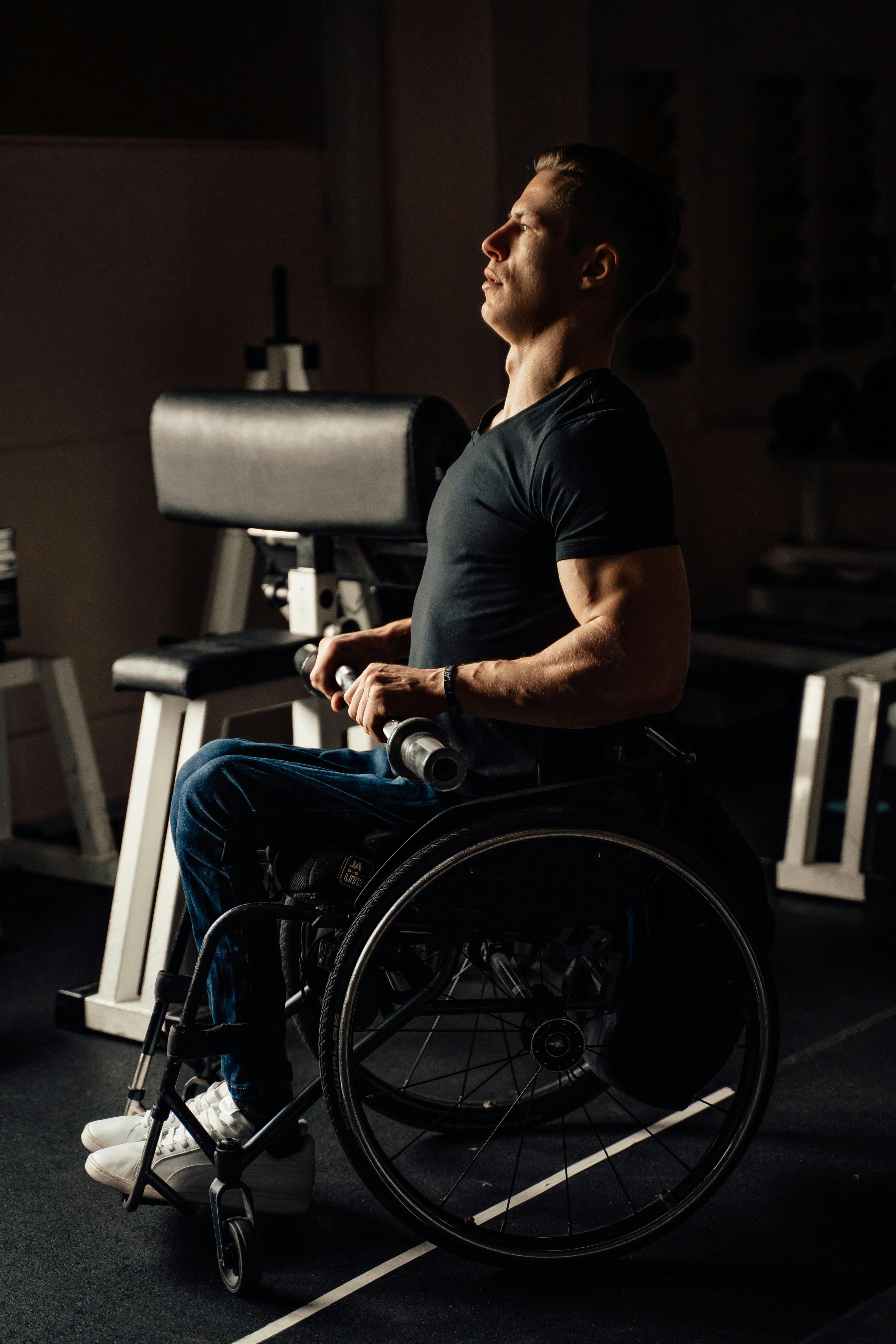 Man in Blue Crew-neck Shirt Staring At Woman Trying To Lift Barbell ...