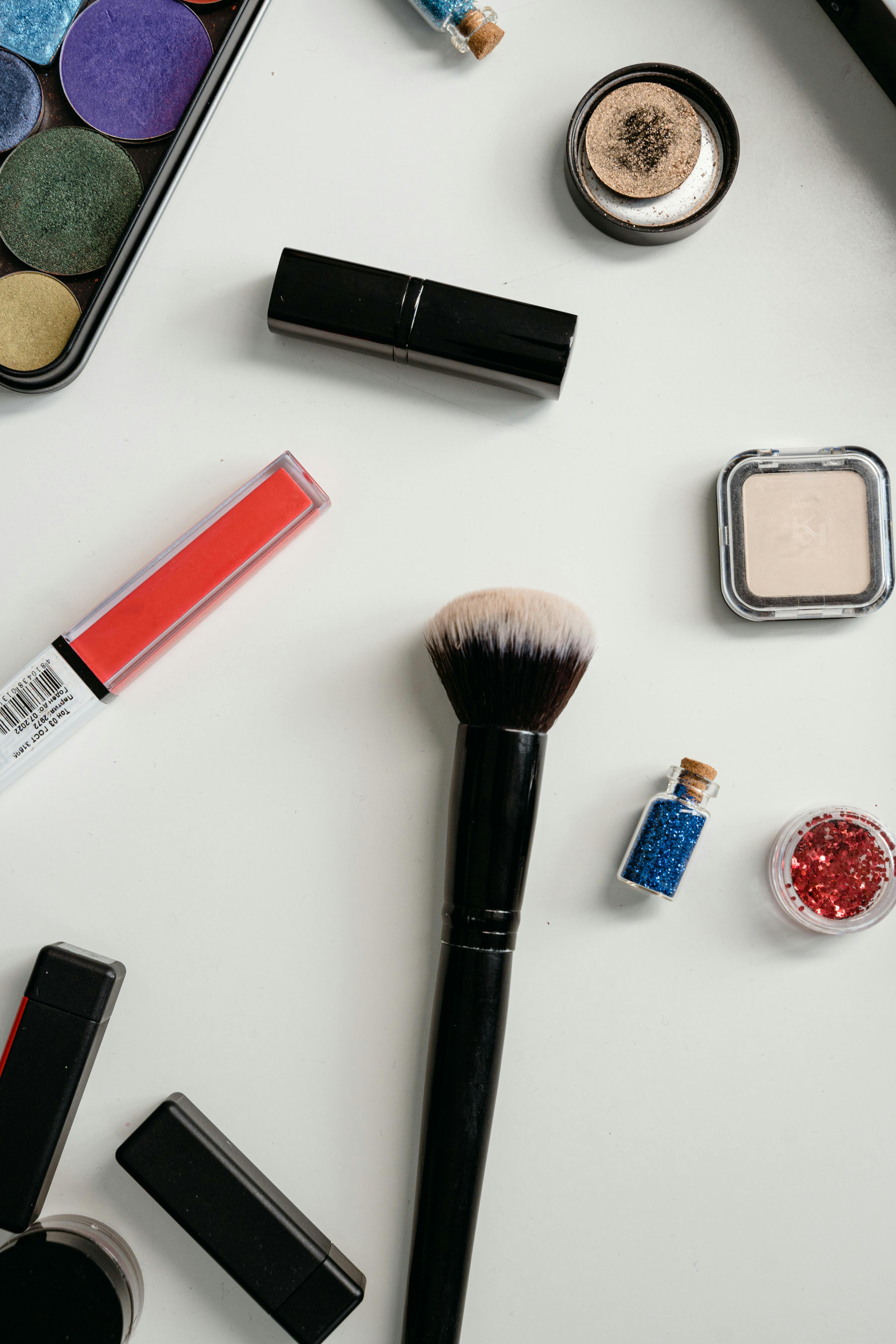 Cosmetic Makeup on White Surface · Free Stock Photo