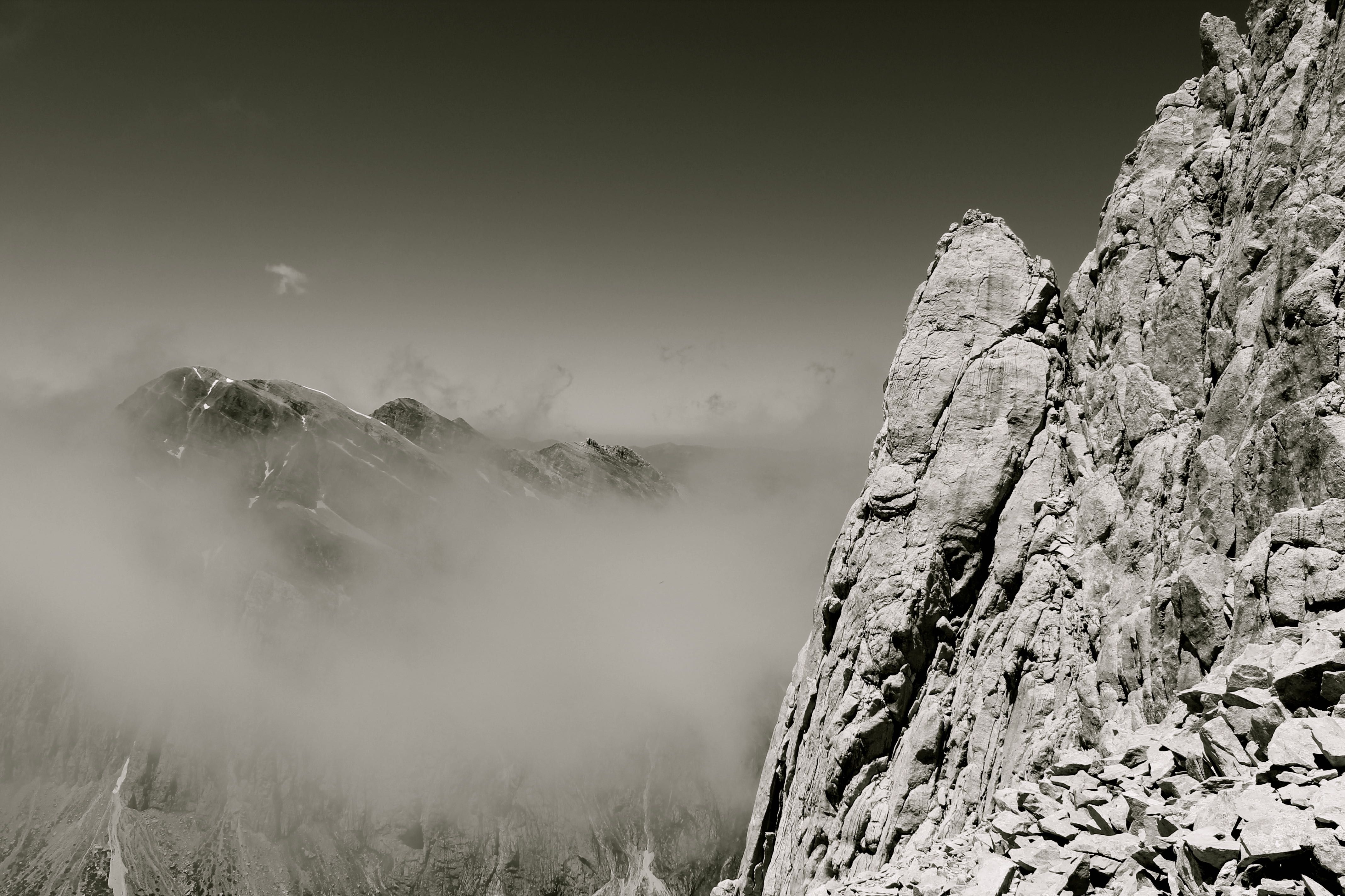 Grayscale Photo of a Rock Formation · Free Stock Photo
