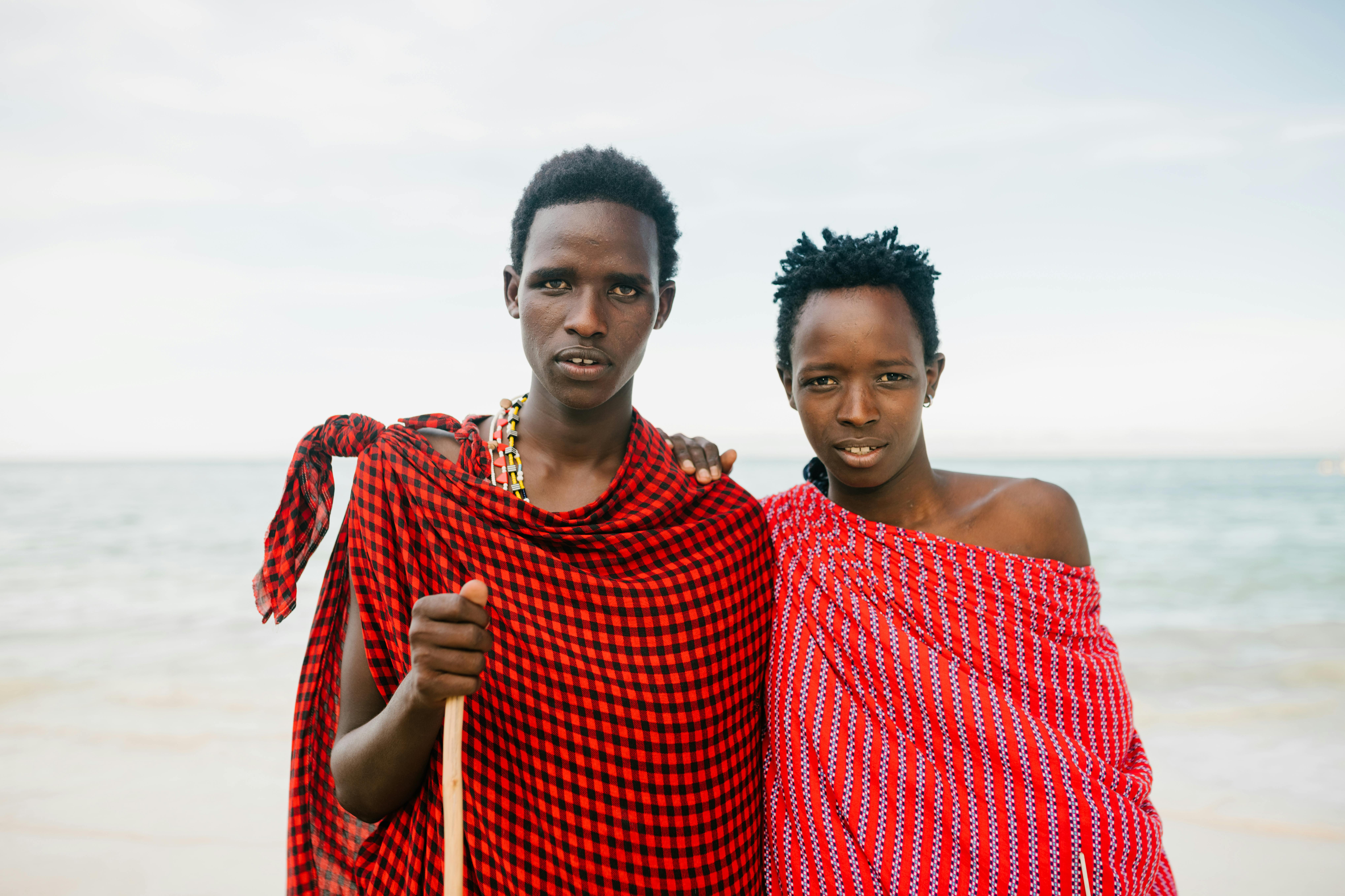 African father and son on seashore · Free Stock Photo