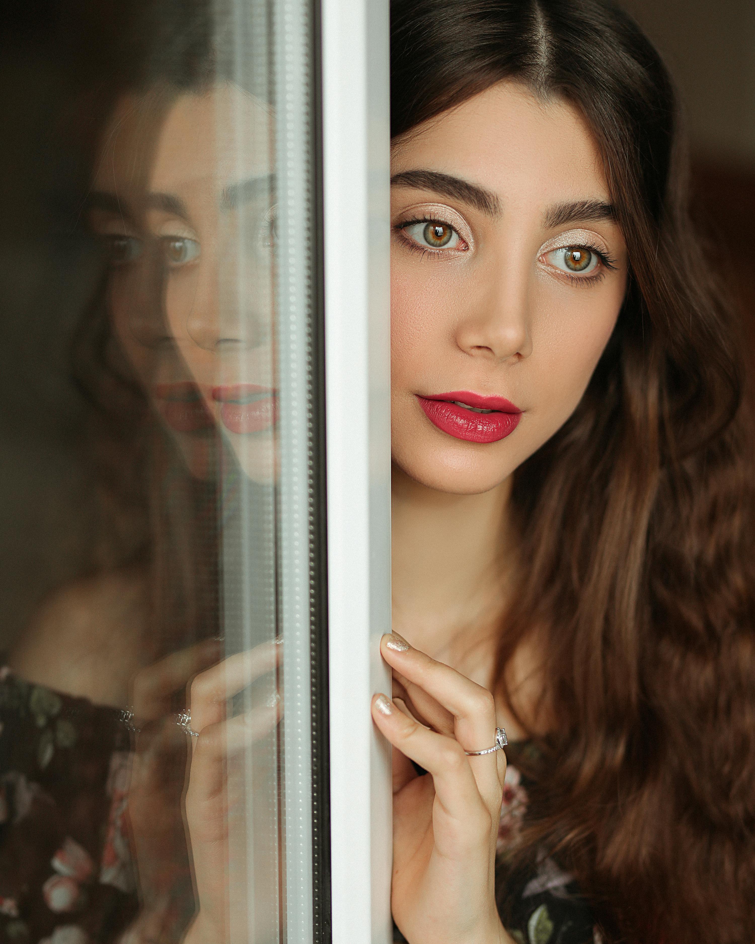 A Beautiful Woman Looking Out the Window · Free Stock Photo