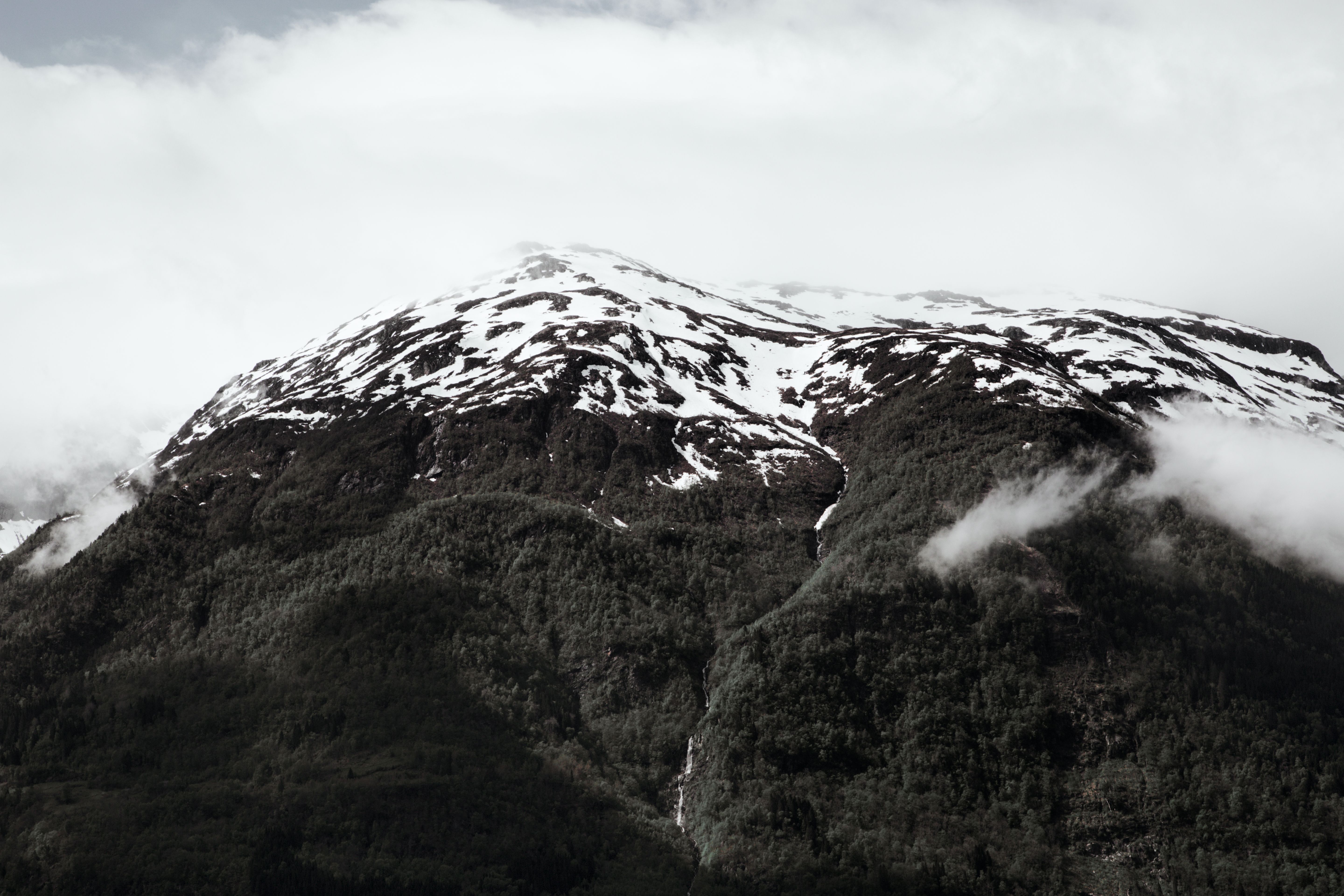 Gray Mountain at Daytime Under Gray Sky · Free Stock Photo