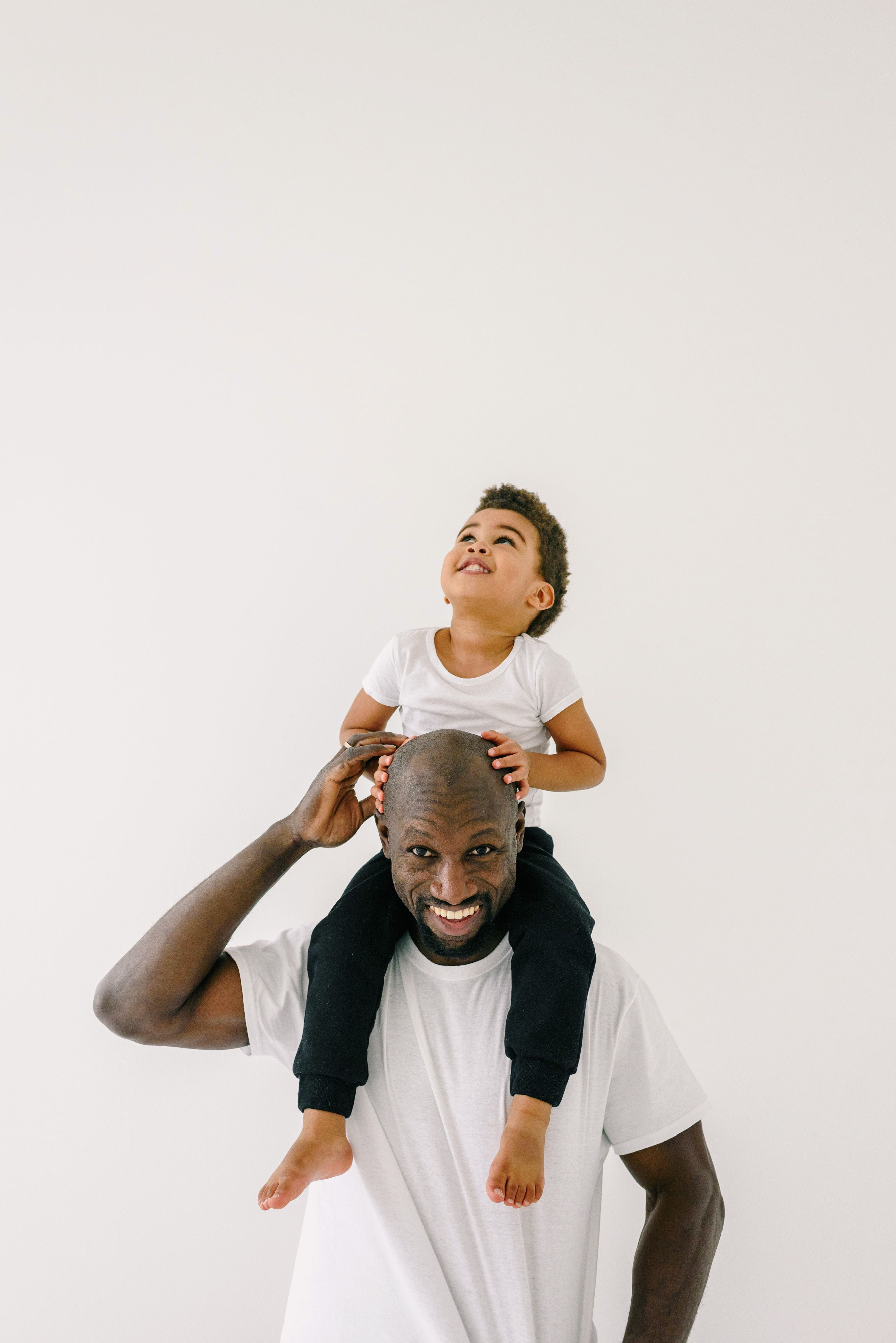 Woman Lifting a Toddler · Free Stock Photo
