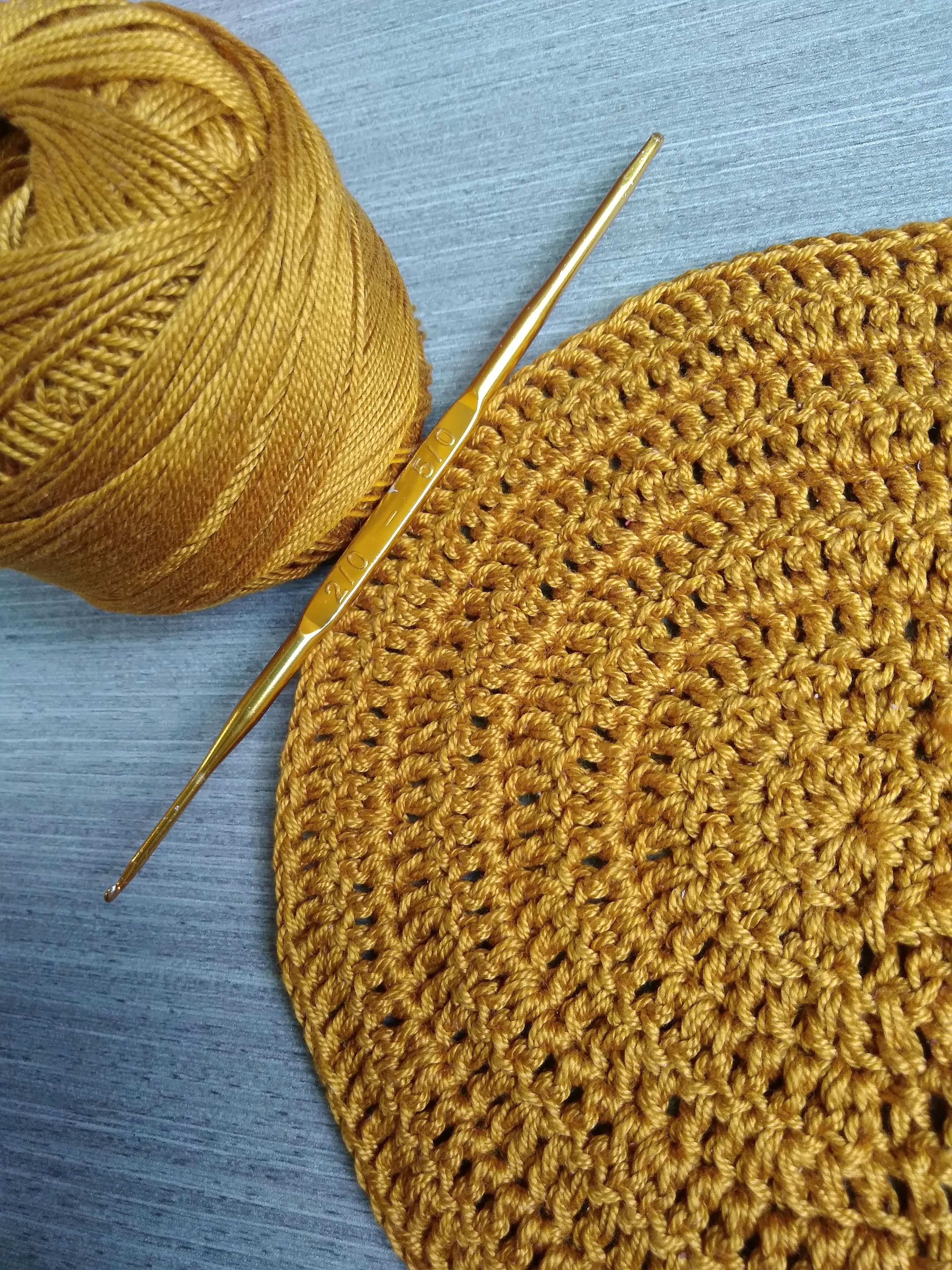 A Person Holding Brown Yarn Ball · Free Stock Photo