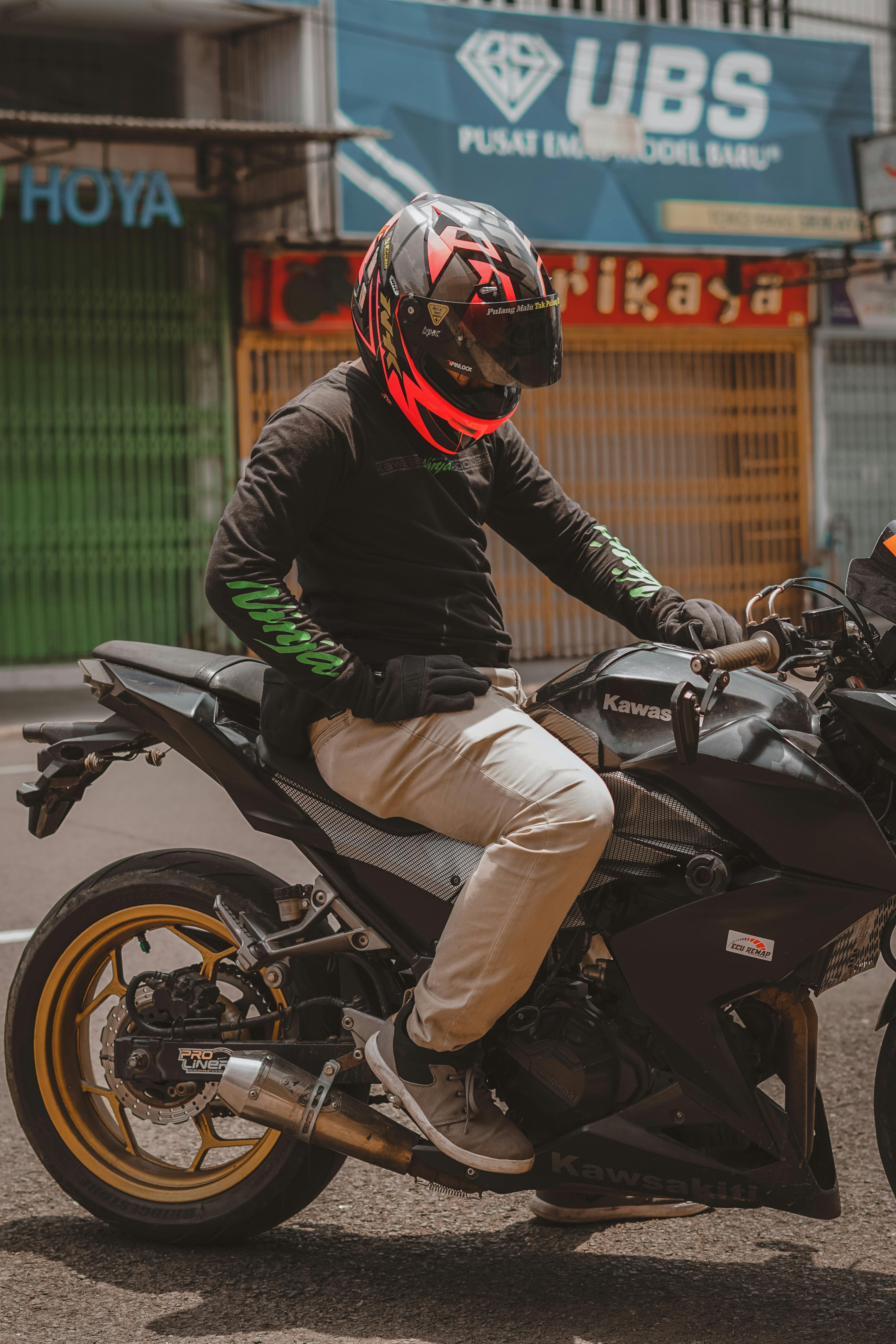 A Man Riding a Motorcycle · Free Stock Photo