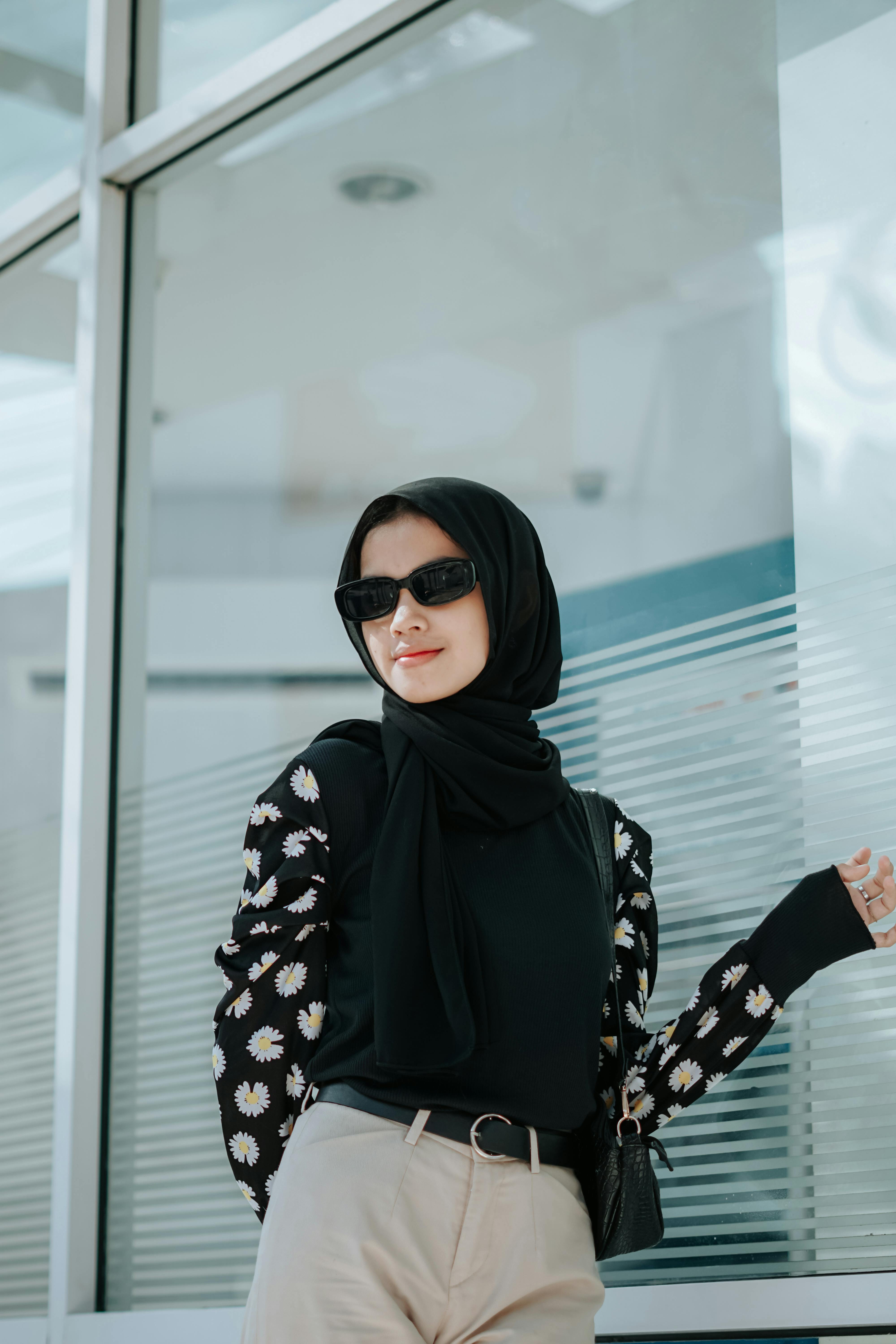 Portrait of a Young Woman Wearing a Black Headscarf · Free Stock Photo
