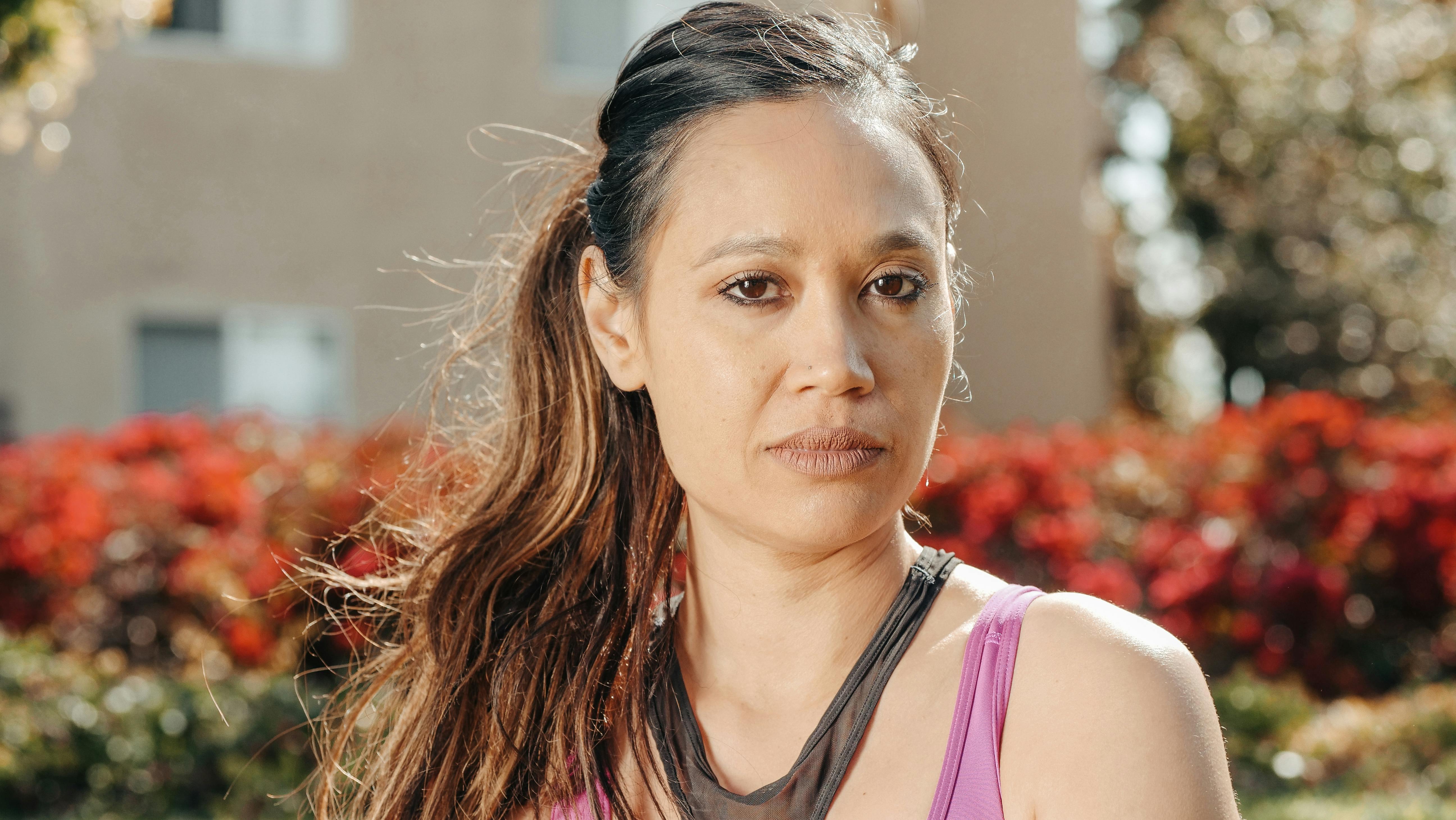 Expressionless Woman in Close Up · Free Stock Photo