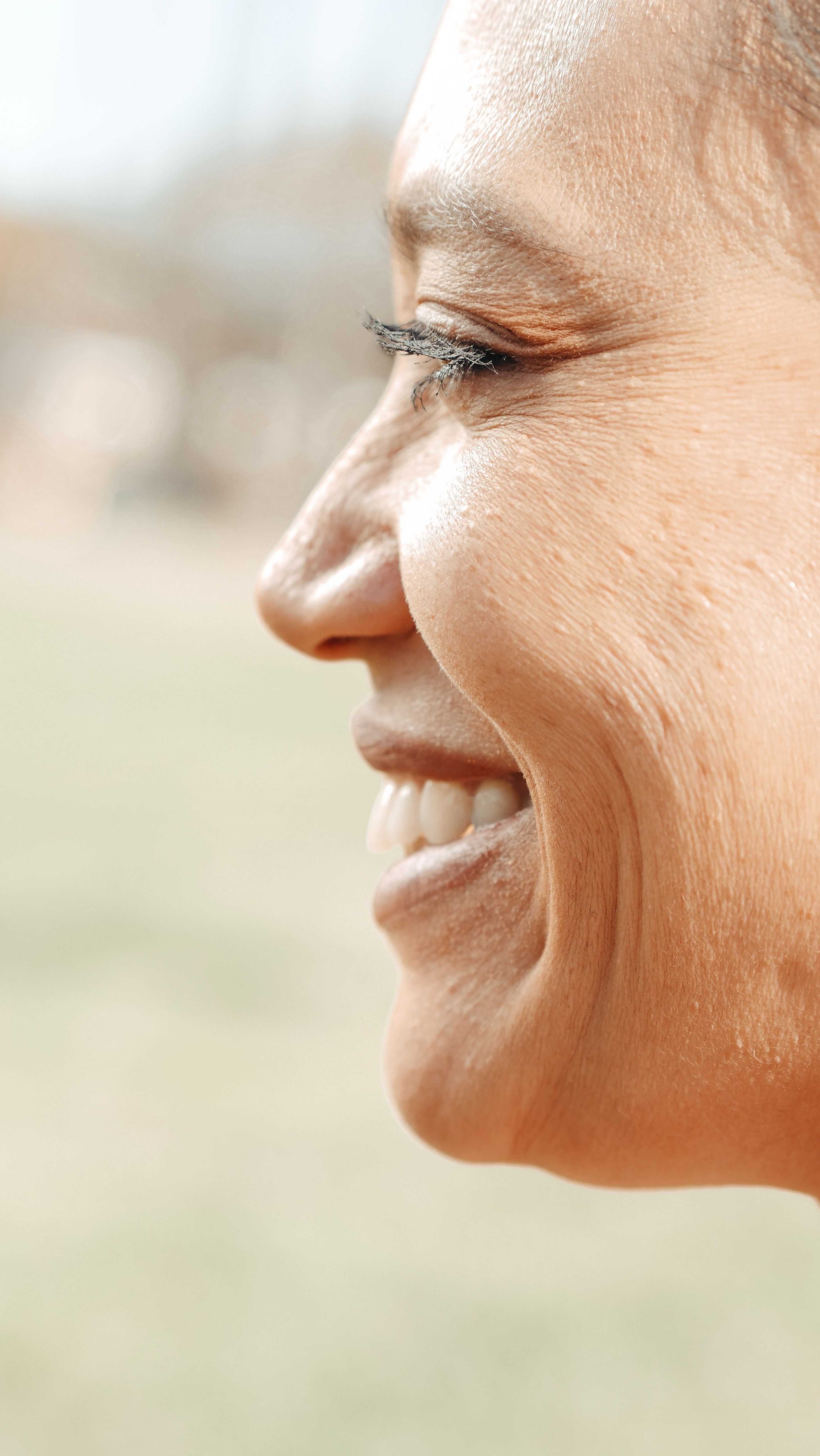 Side Profile on Smiling Woman · Free Stock Photo
