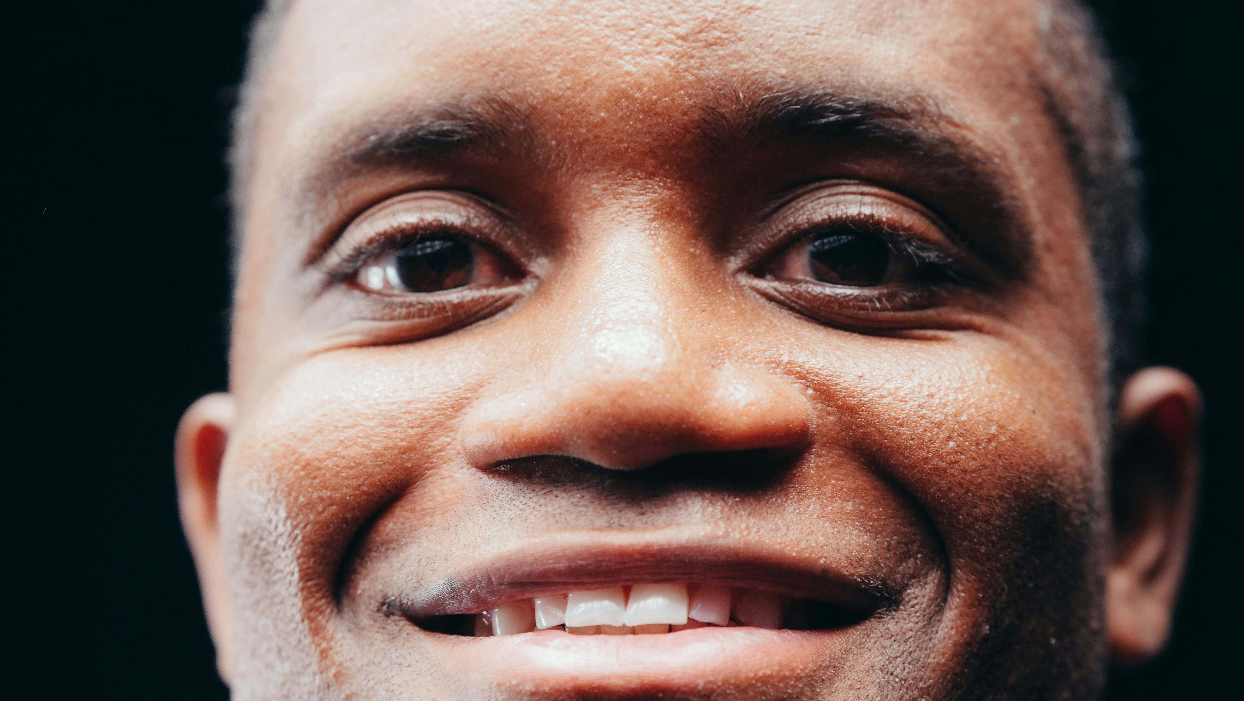 Smiling Man using Machine · Free Stock Photo