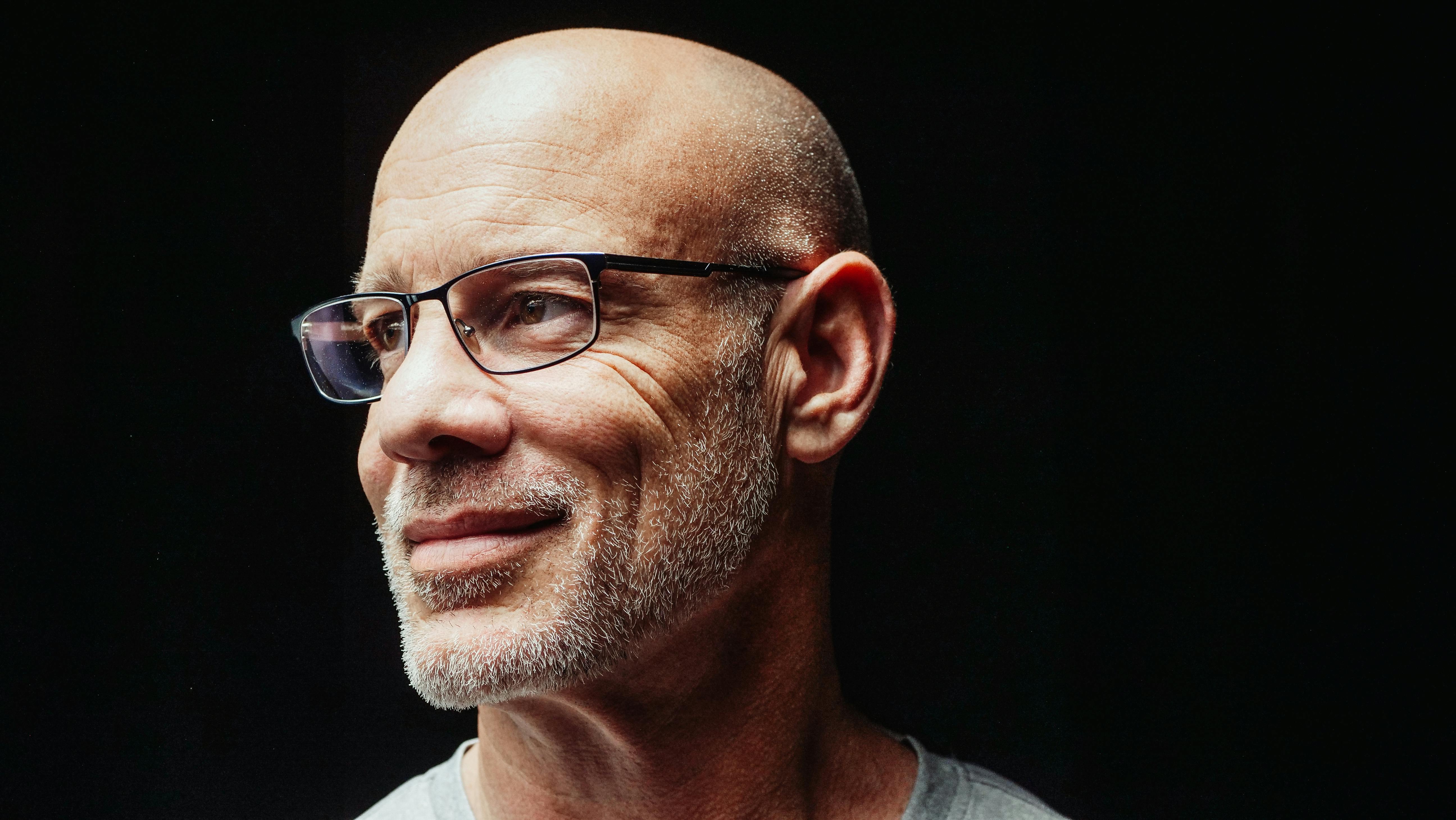 A Man with Numbers on his Shirt Pointing his Finger · Free Stock Photo