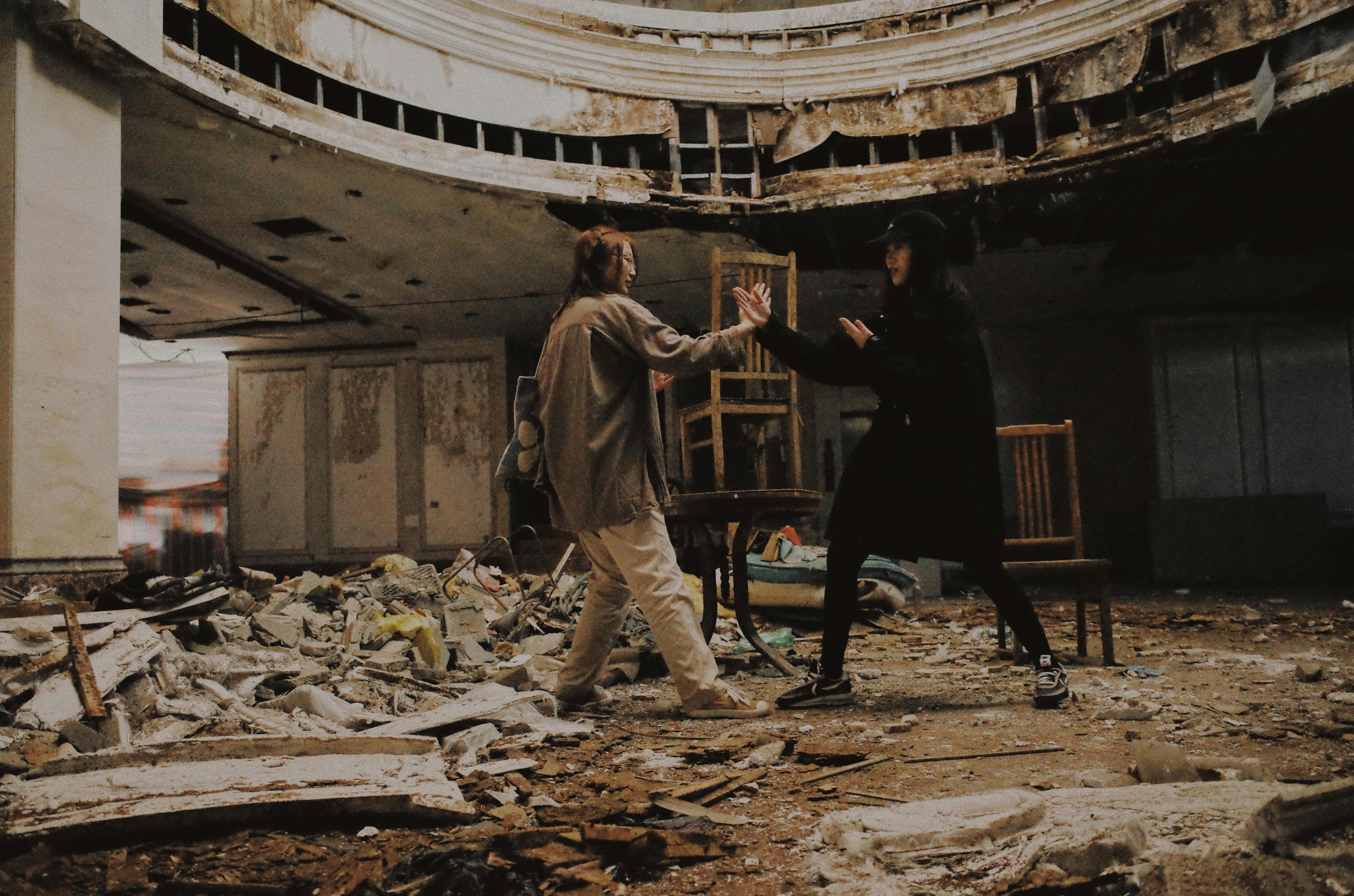 Women Pretending to Fight Among Rubble in an Abandoned Building · Free ...