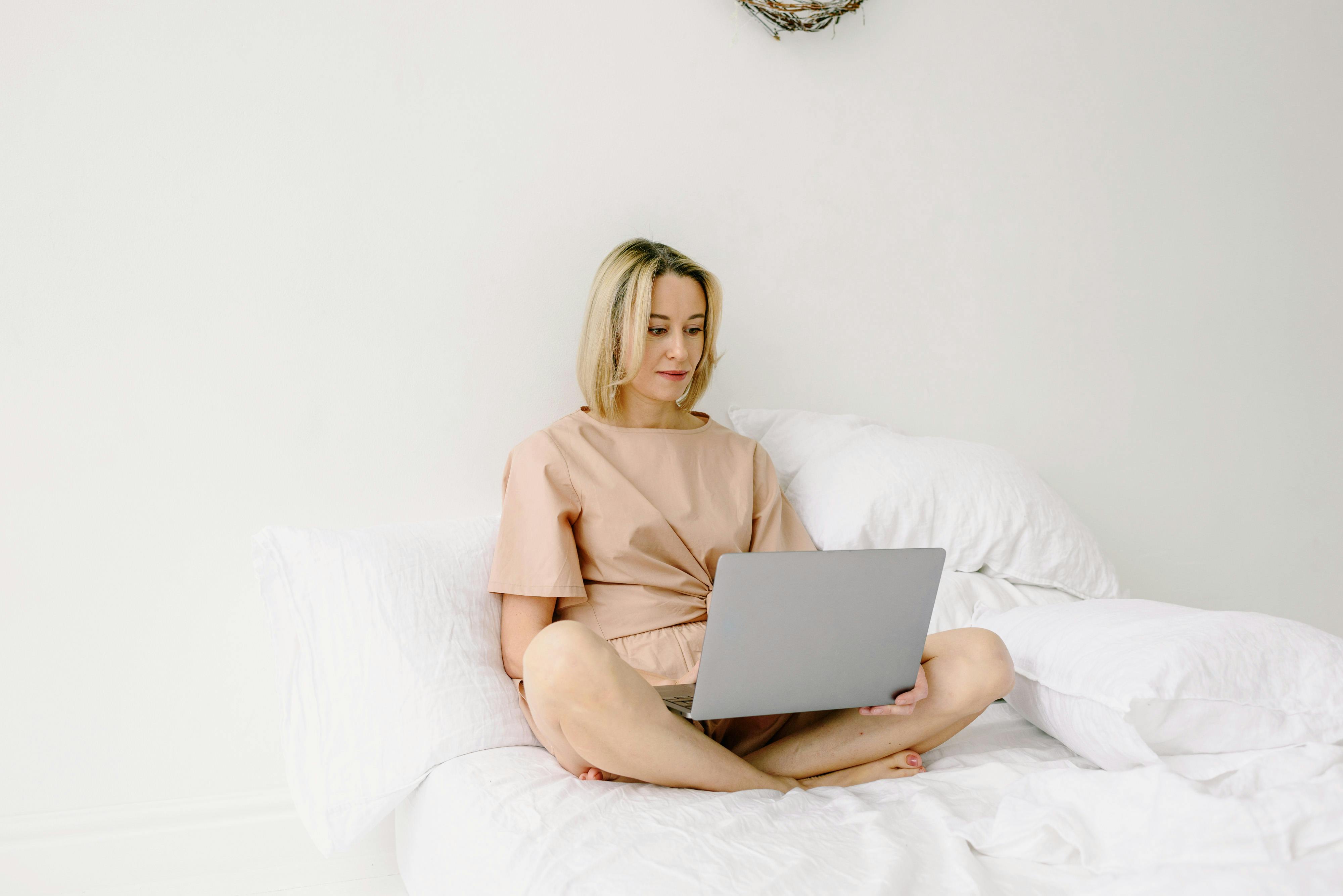 A Laptop in Bed · Free Stock Photo