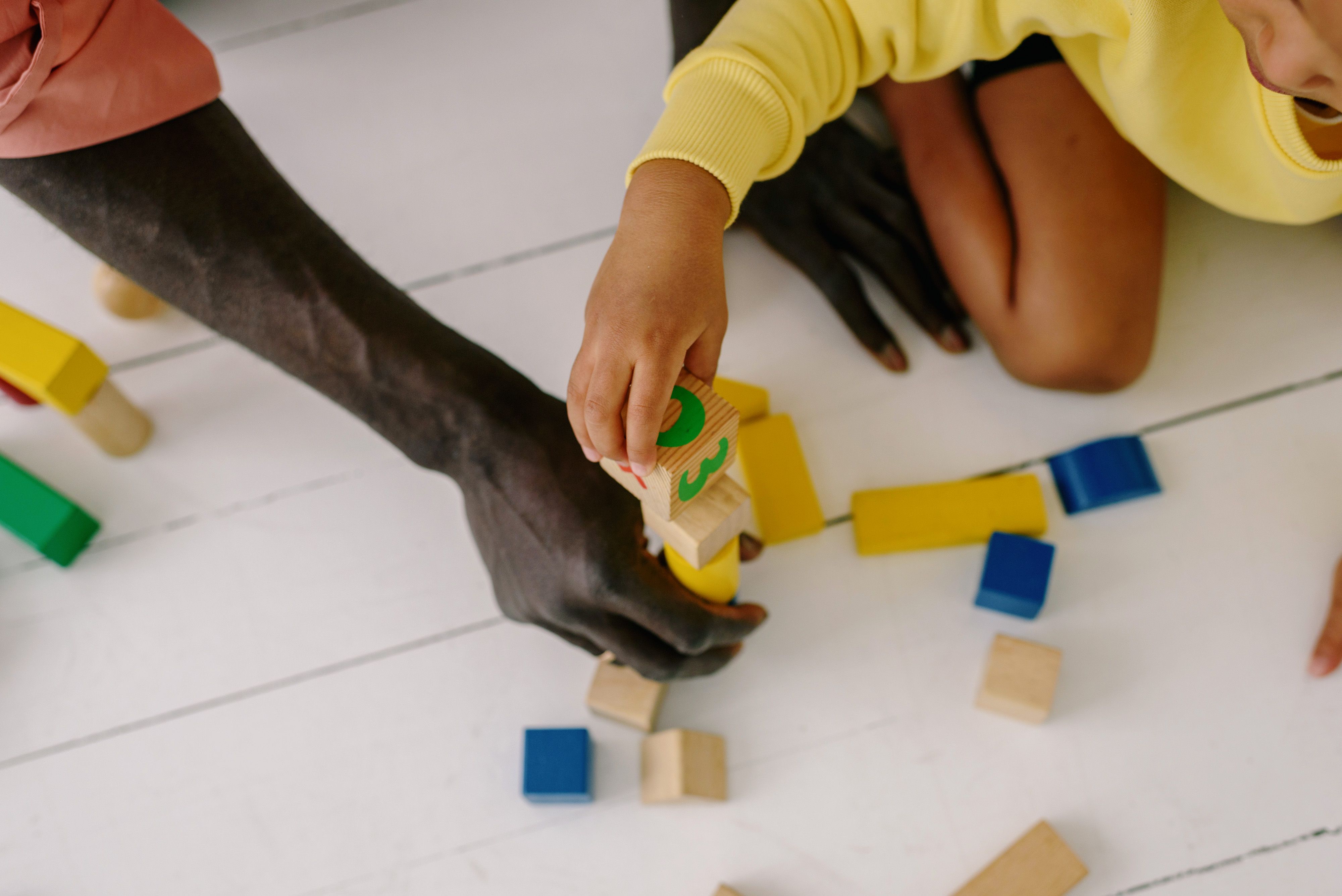 A Person Building Blocks · Free Stock Photo