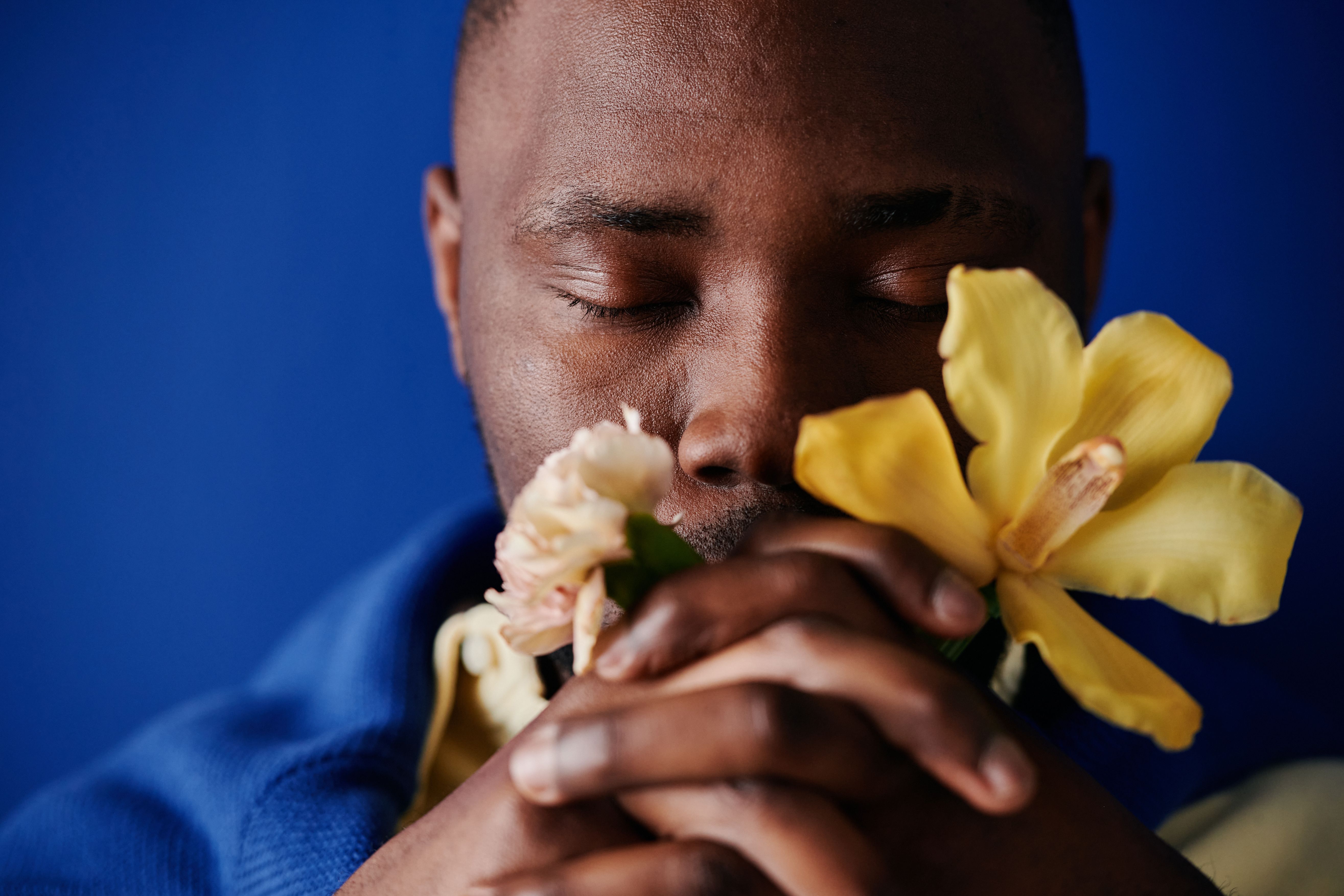 A man With Flowers on Hand · Free Stock Photo