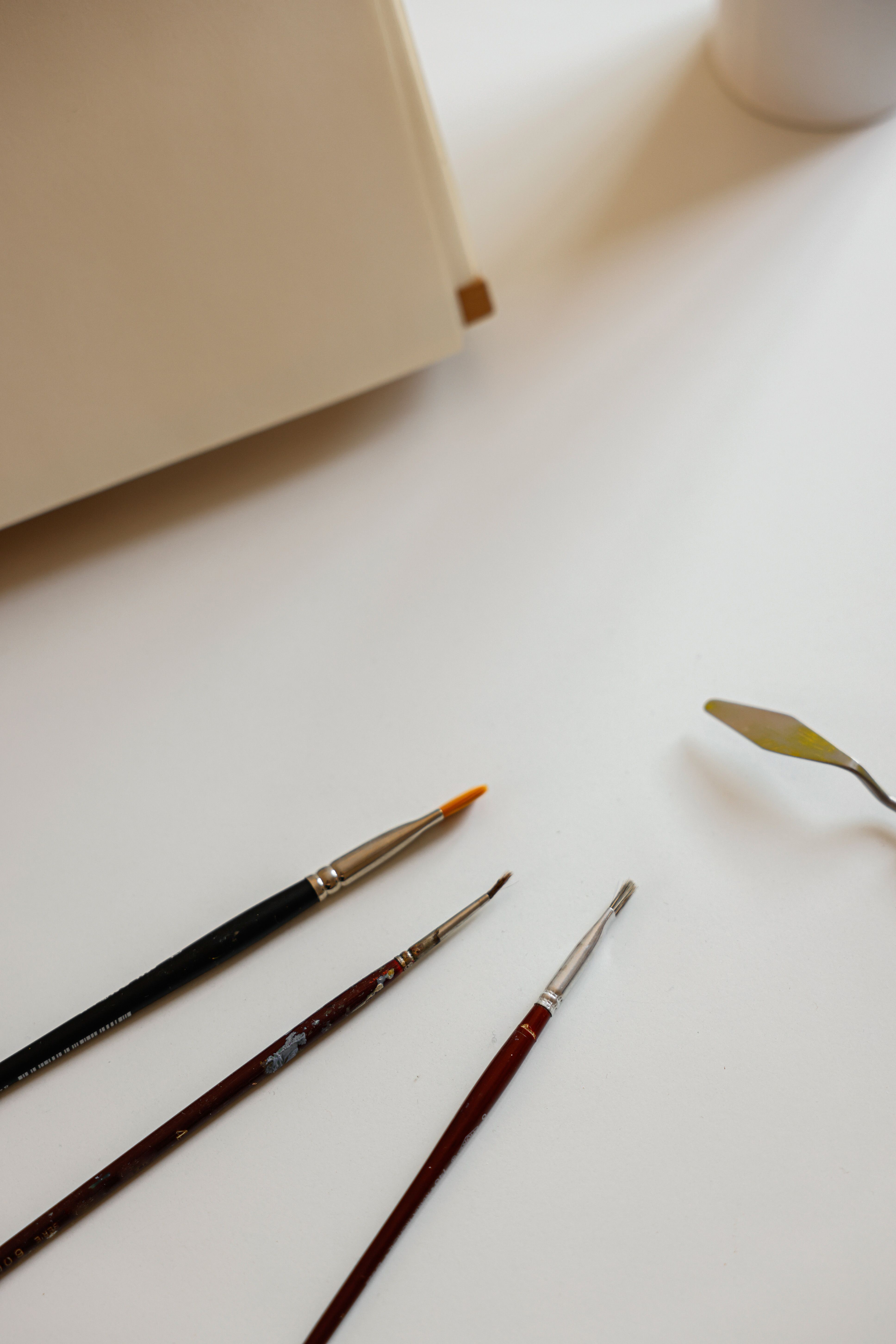 Brushes on White Table · Free Stock Photo