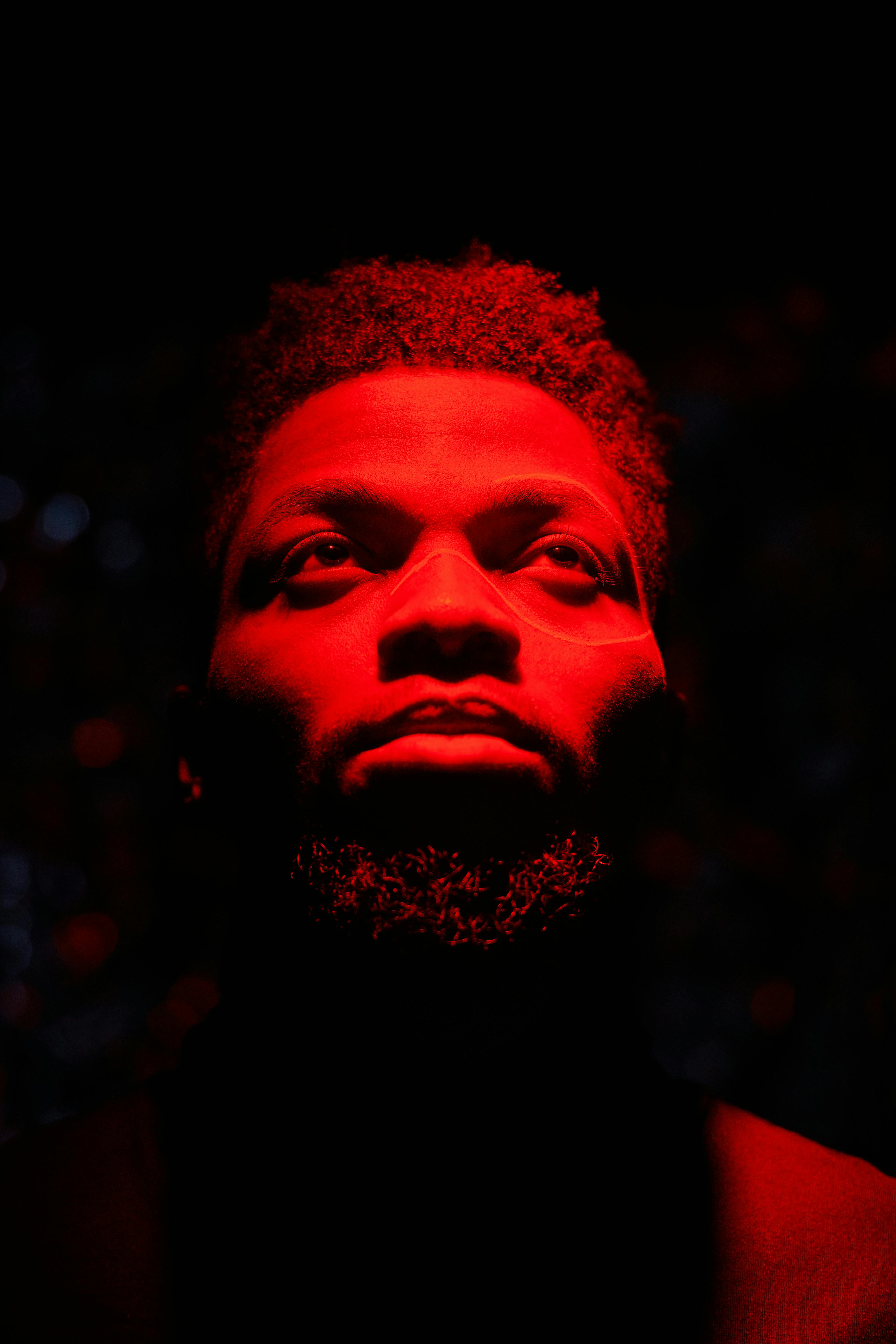 A Mans Face with a Red Light · Free Stock Photo