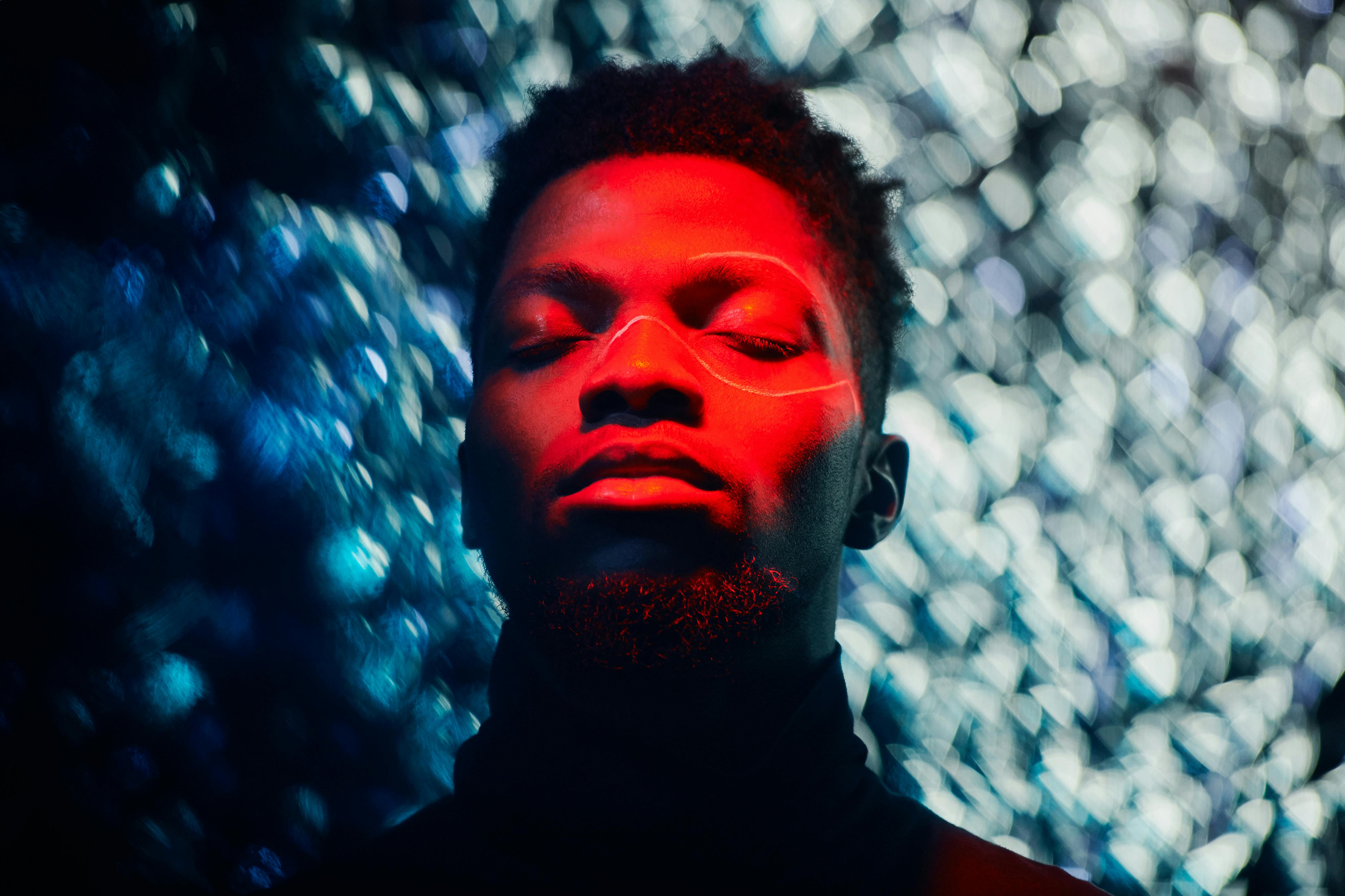 A Mans Face with a Red Light · Free Stock Photo