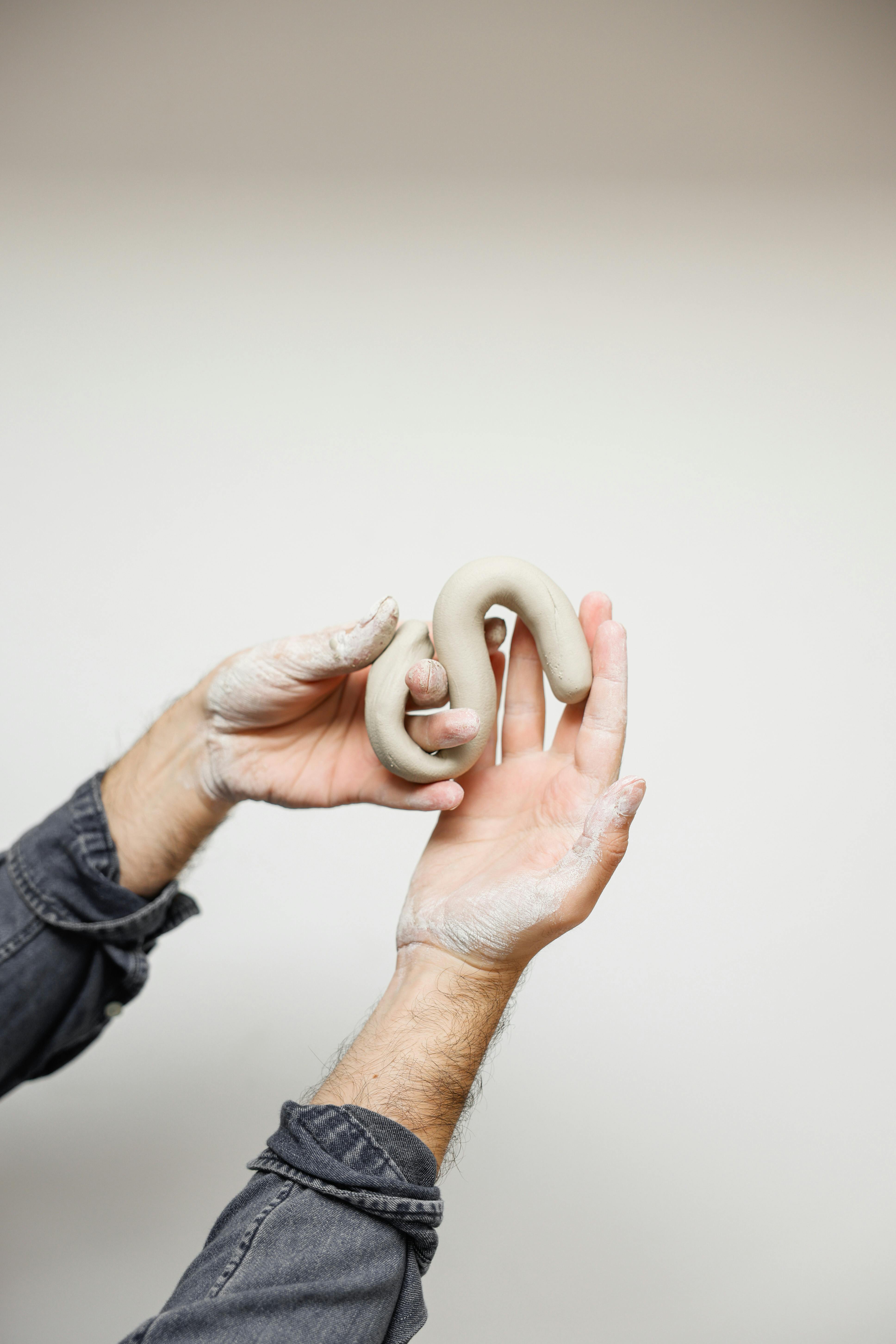Person holding a Clay · Free Stock Photo