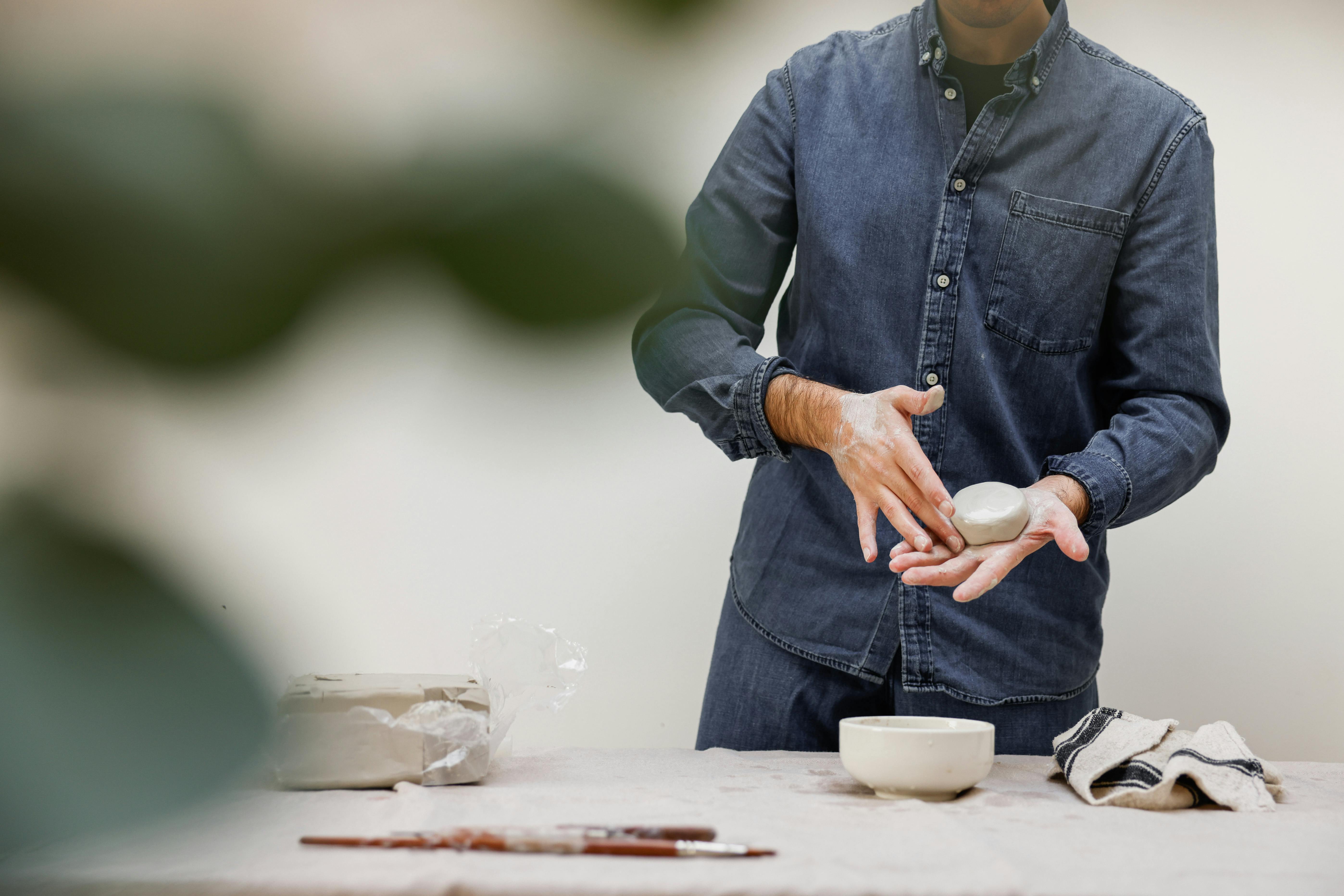 Man with Clay in His Hands · Free Stock Photo