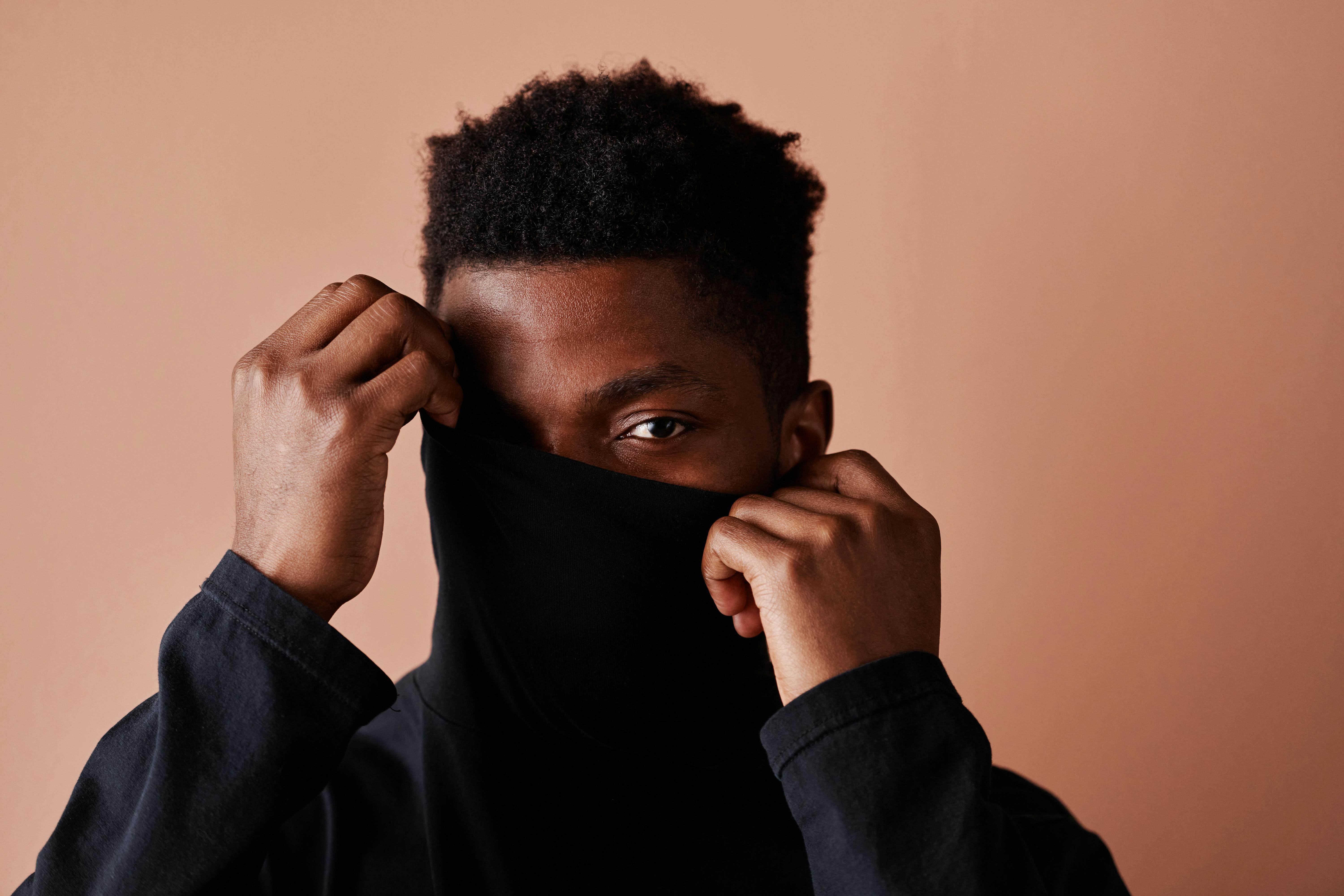 A Man Covering His Face · Free Stock Photo