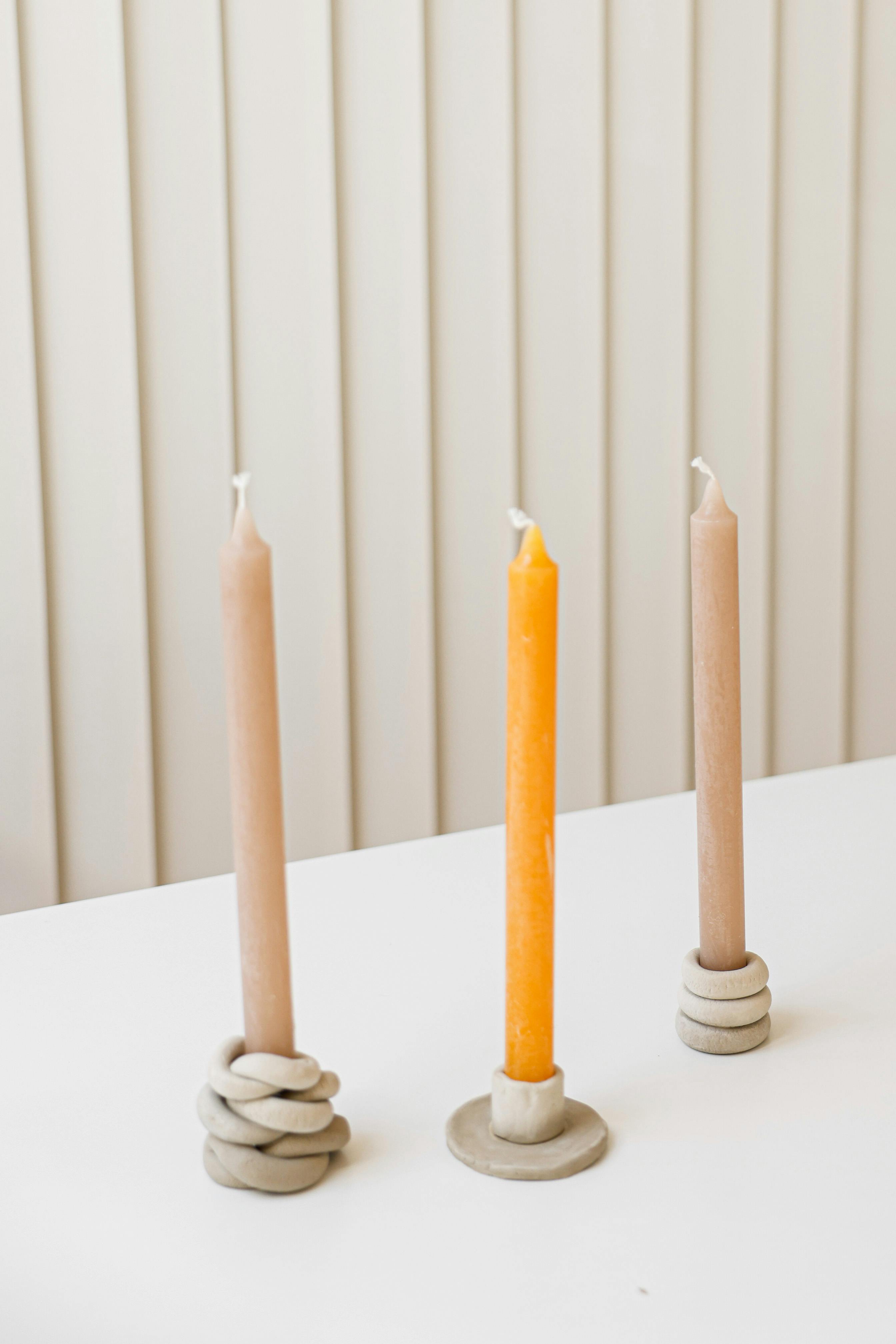 Candles Standing in Homemade Candlesticks · Free Stock Photo